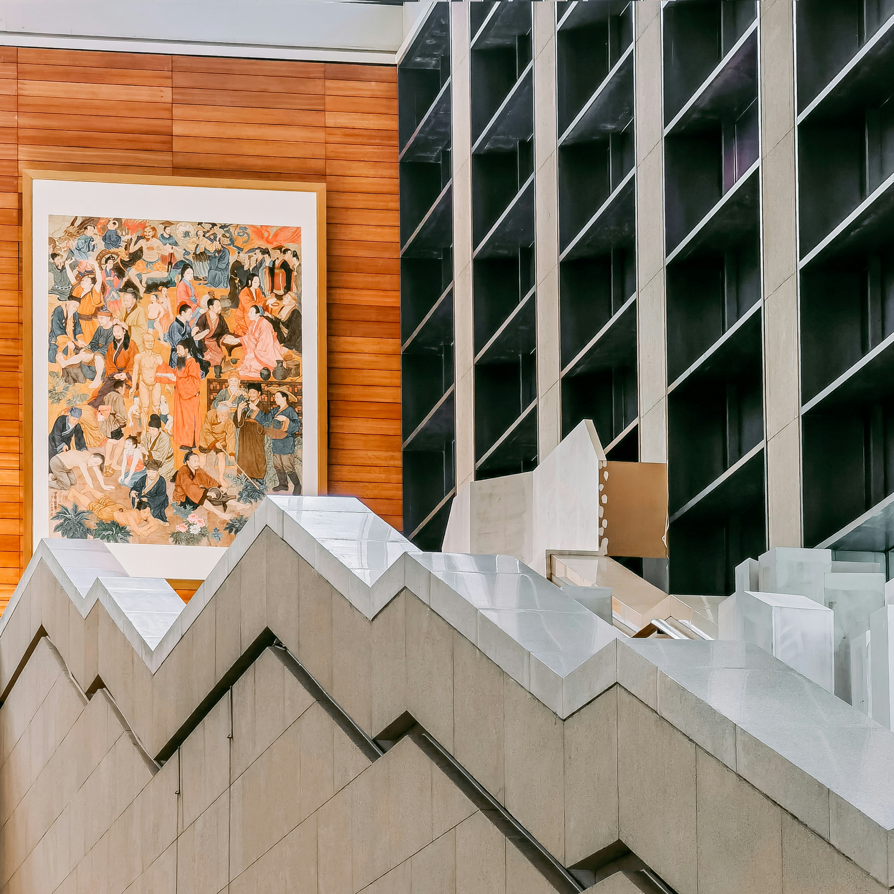 Staircase Geometry Framing a Vivid Painting in a Modern Gallery