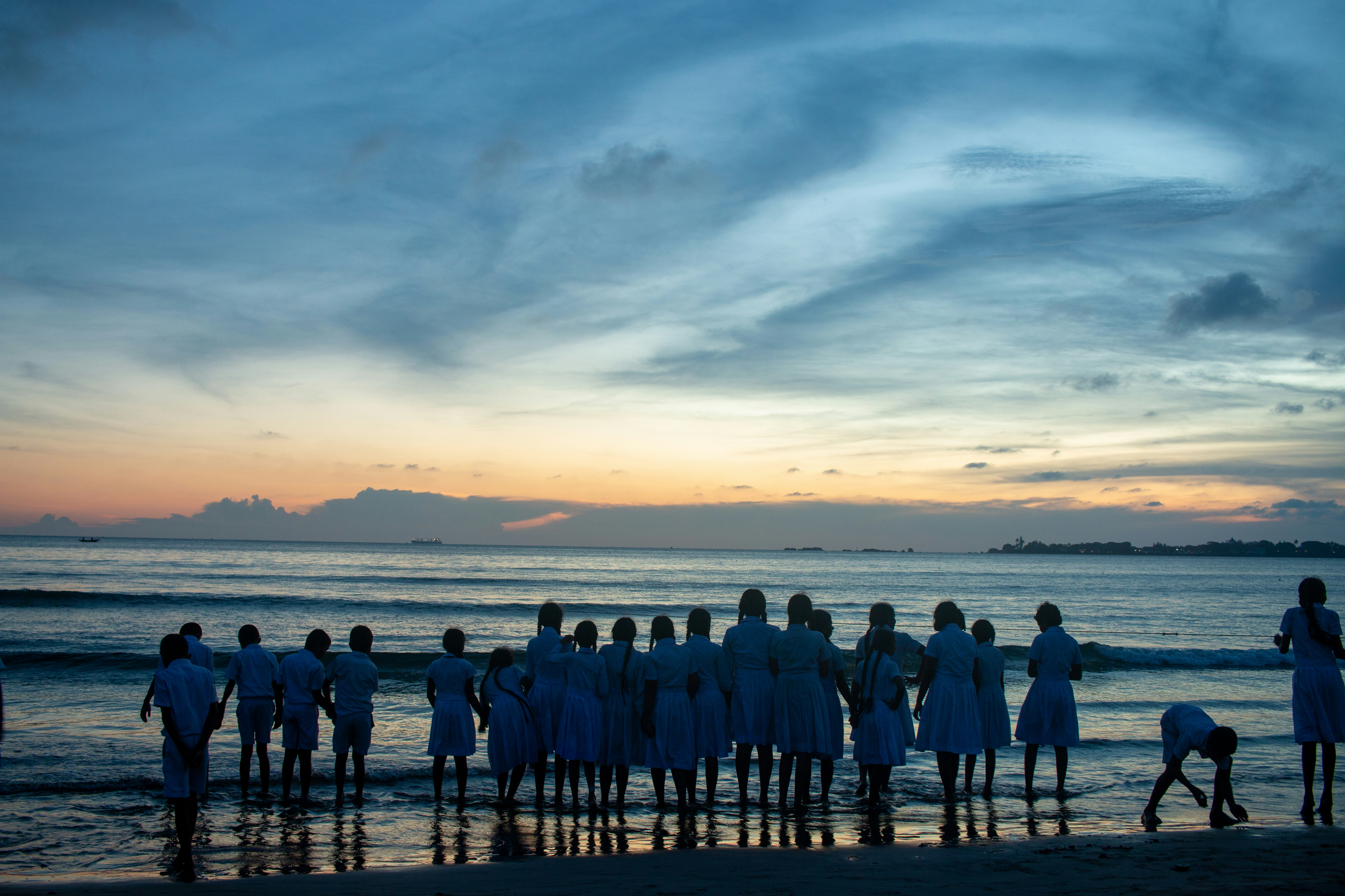 People standing on beach during sunset photo – Free Sunset Image on ...