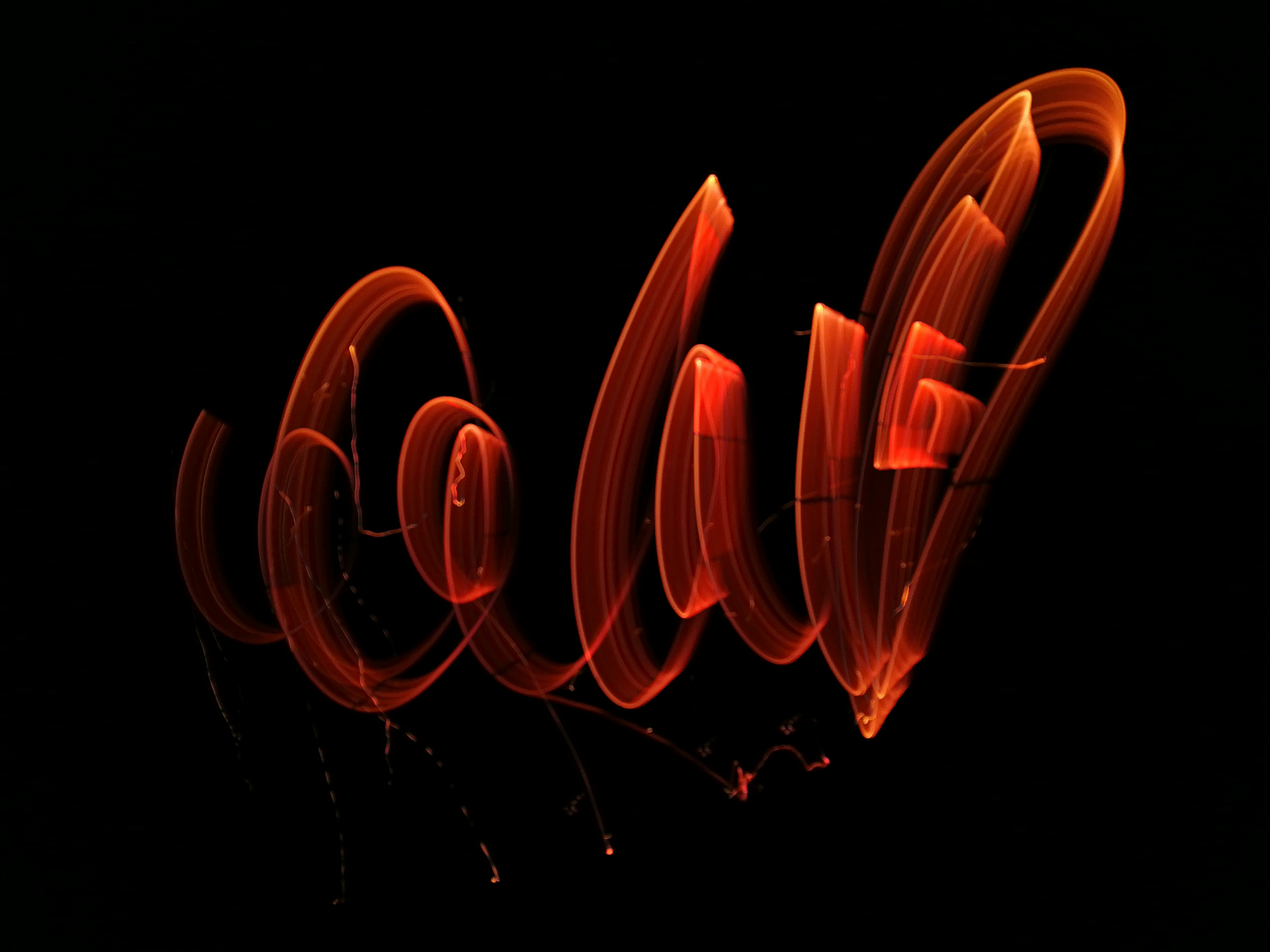 Ignited Script: Neon-red Light Trails Streak Across the Void