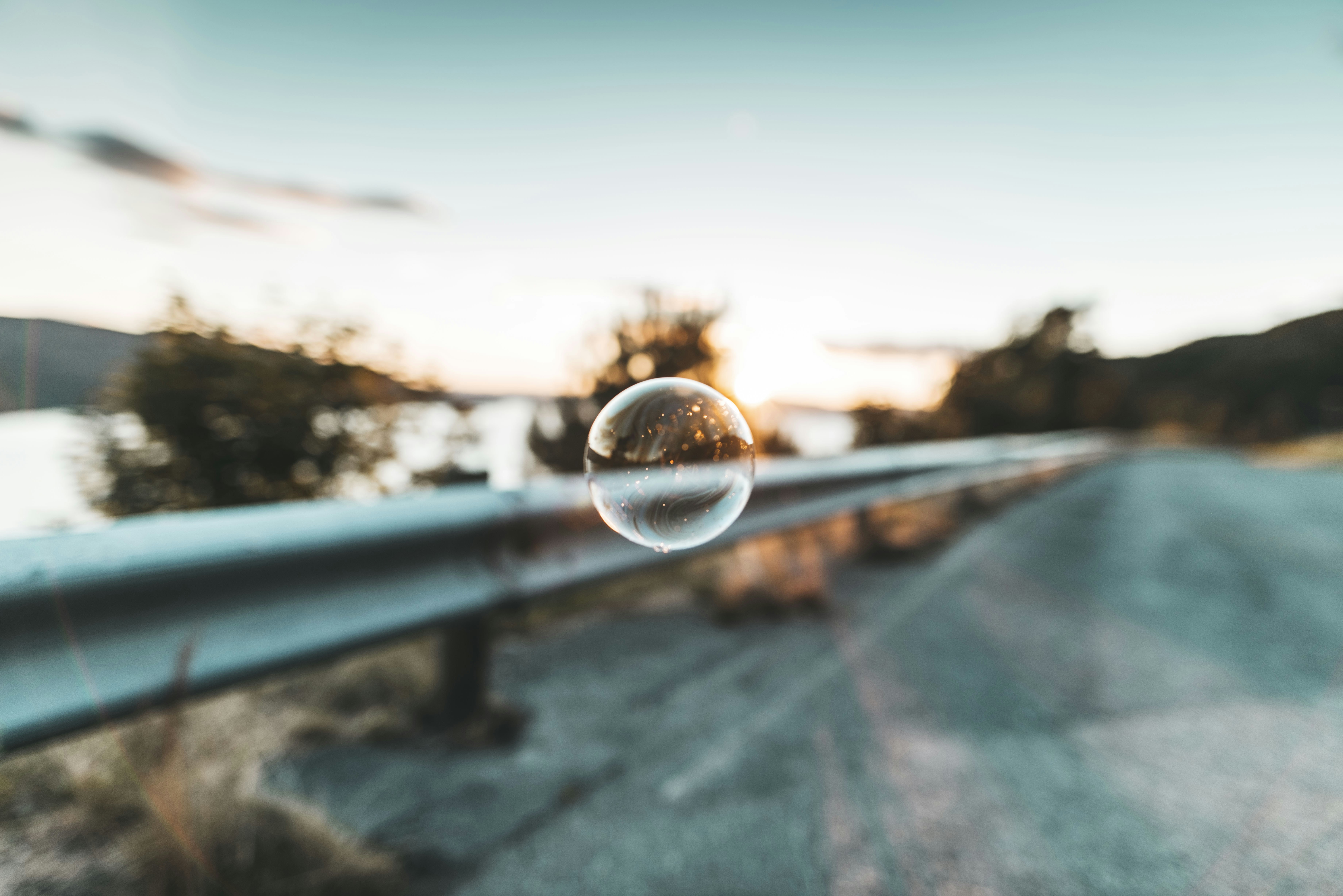 Bubble on the Rail: A Moment of Quiet in the Waterfront Sunset