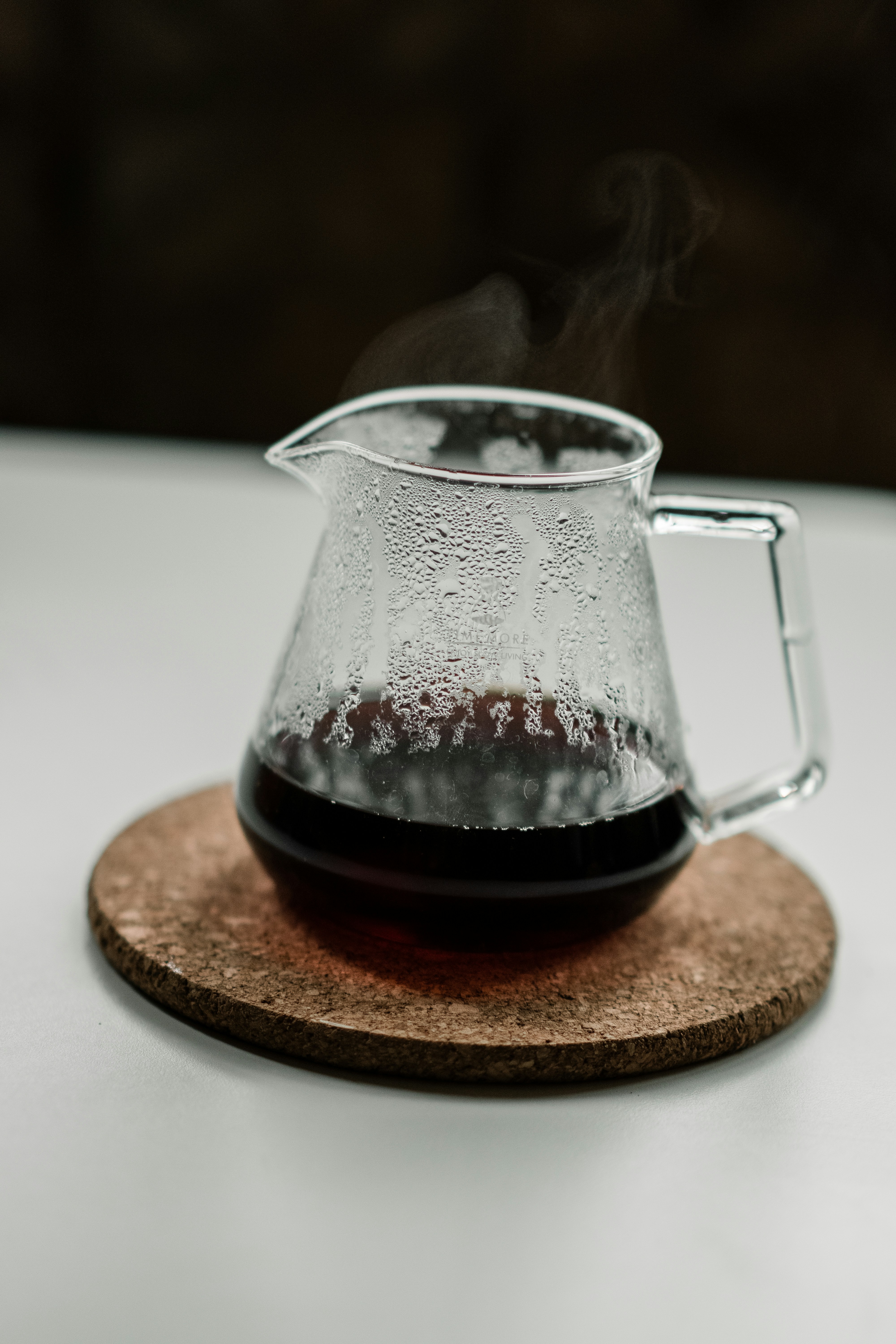 Clear glass pitcher on brown wooden coaster photo – Free Kyiv Image on ...