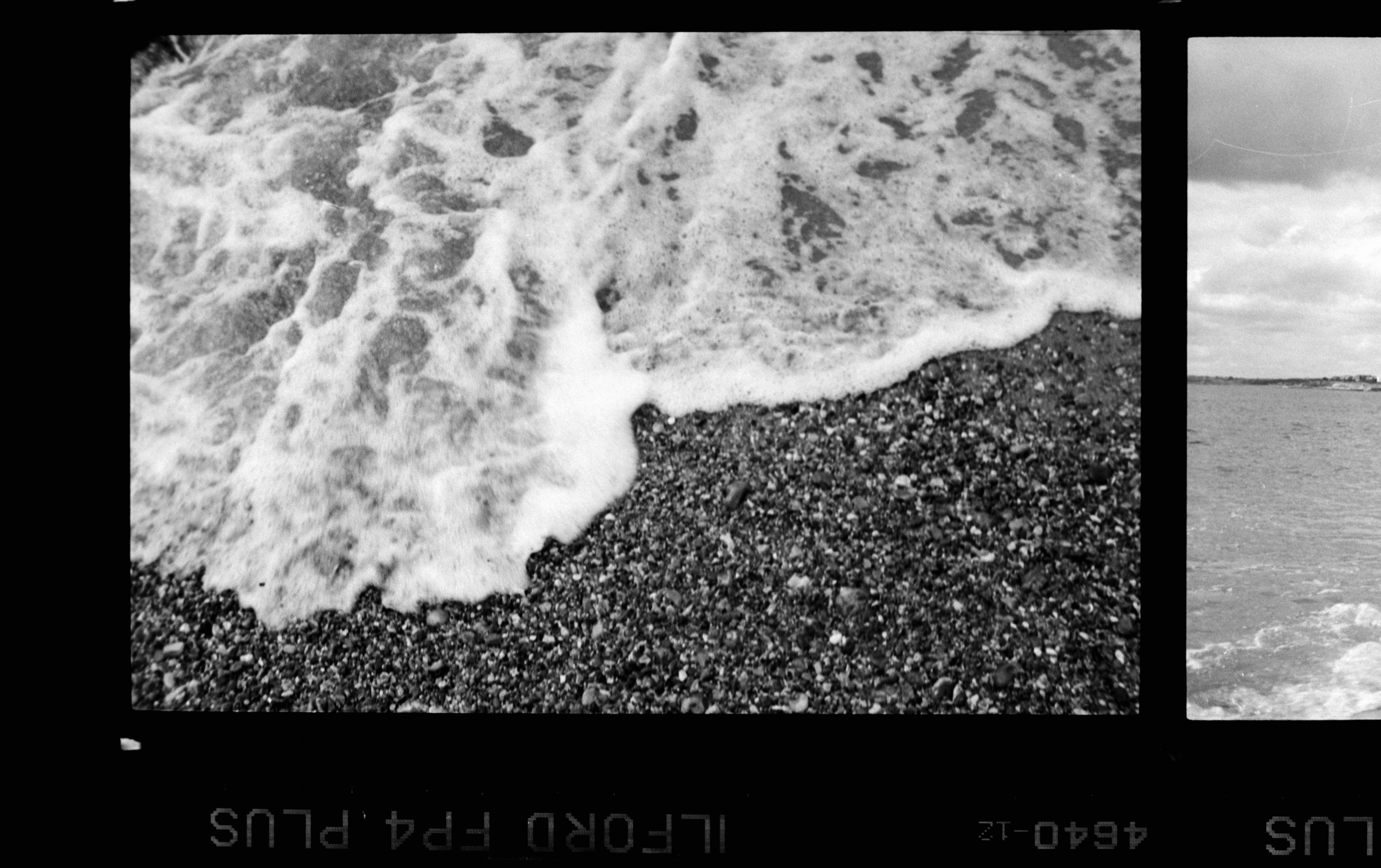 Pebble Beach Wave Crest: A Monochrome Sea in Film Strips