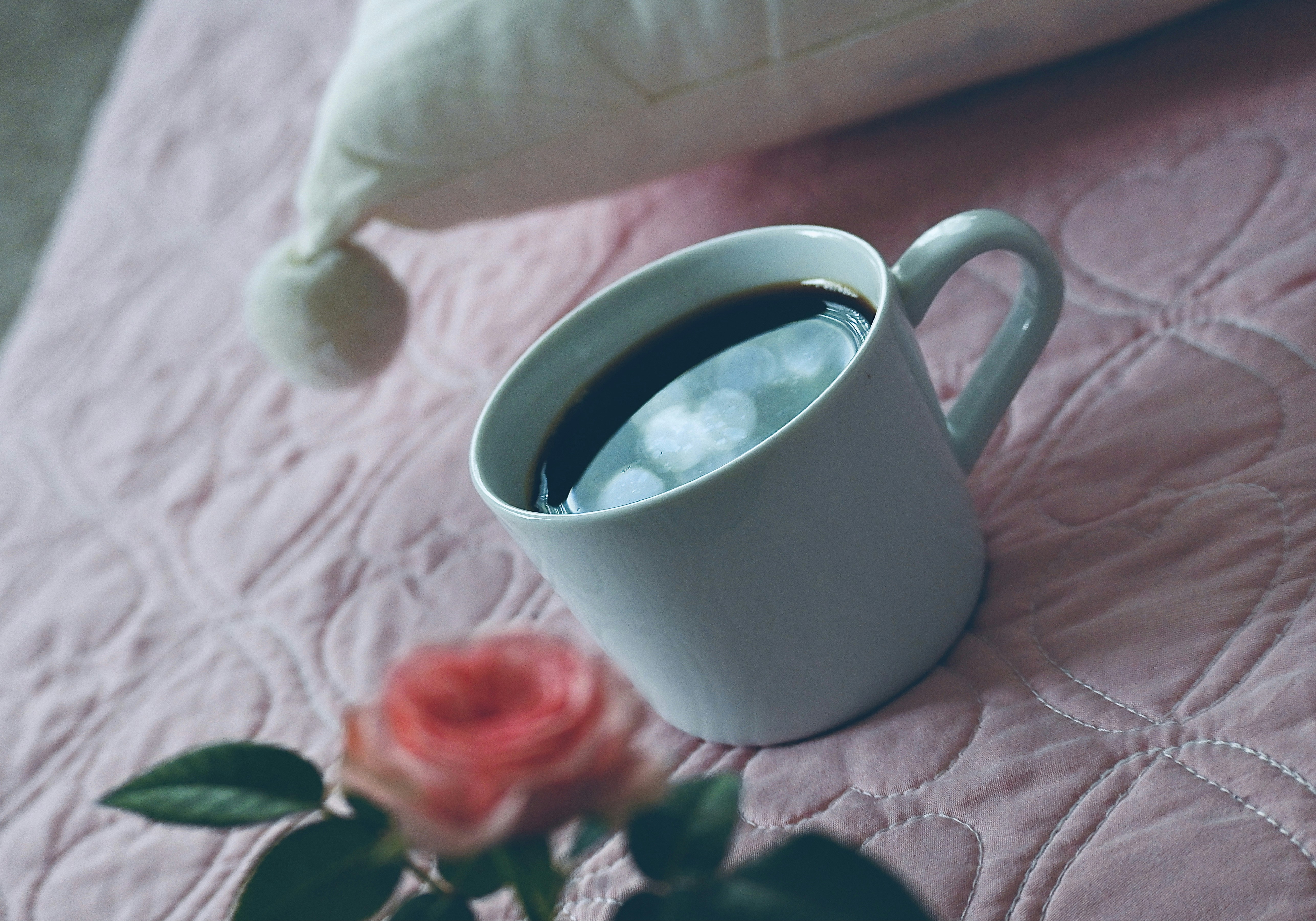white ceramic mug with black liquid