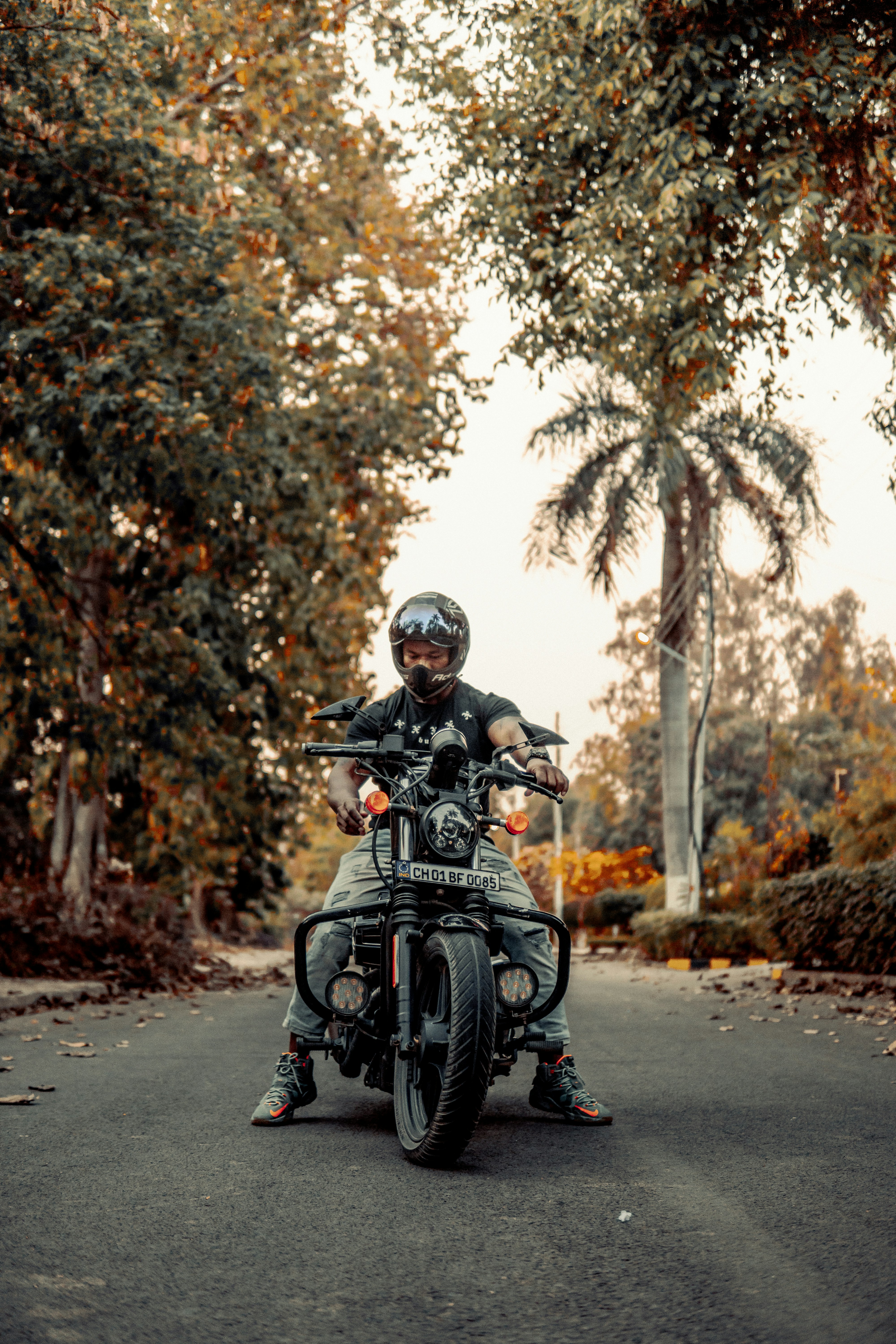 Man in black motorcycle helmet riding motorcycle on road during daytime ...