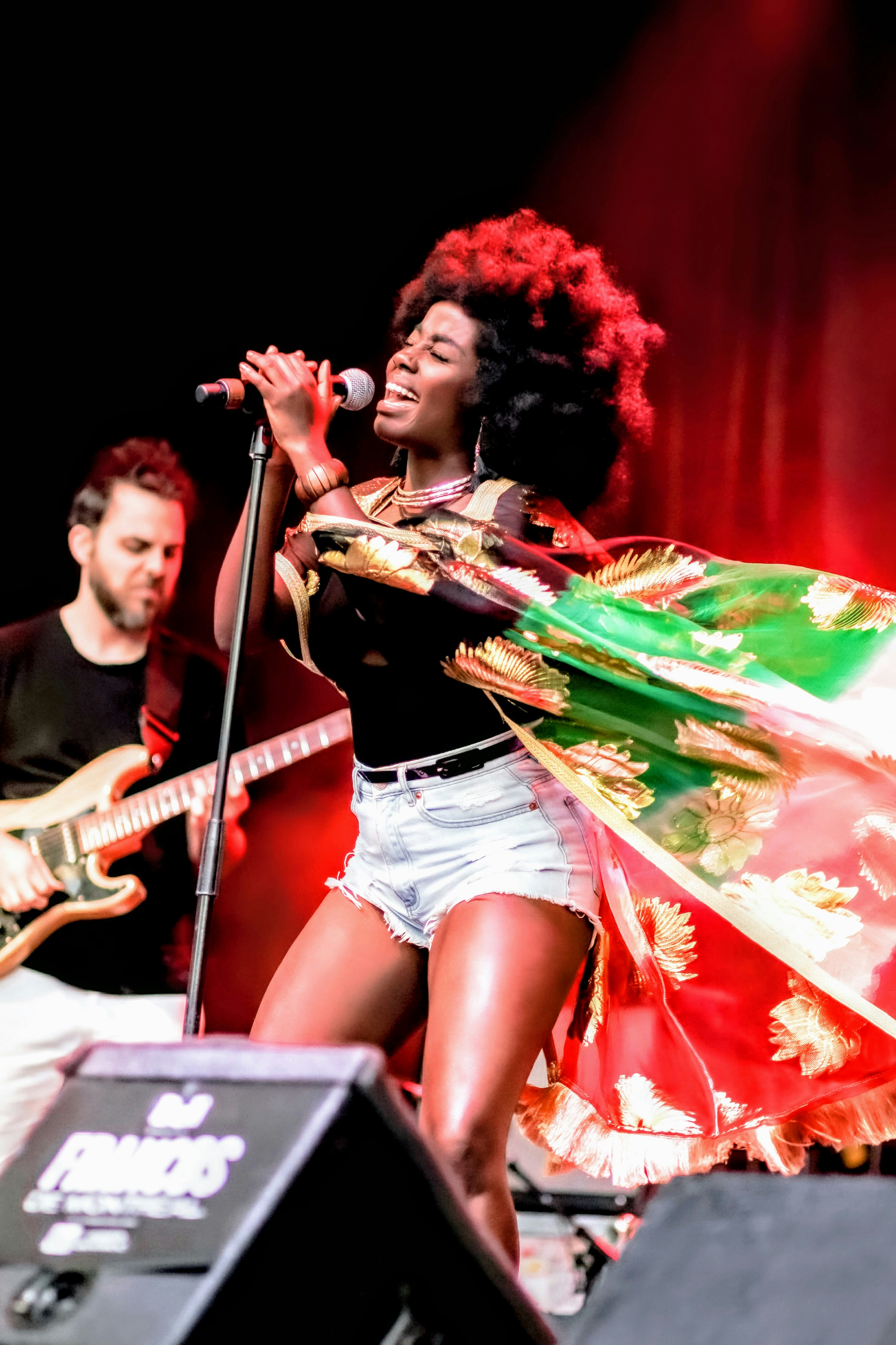 Stage Pulse: The Bold Singer with Neon Red Afro