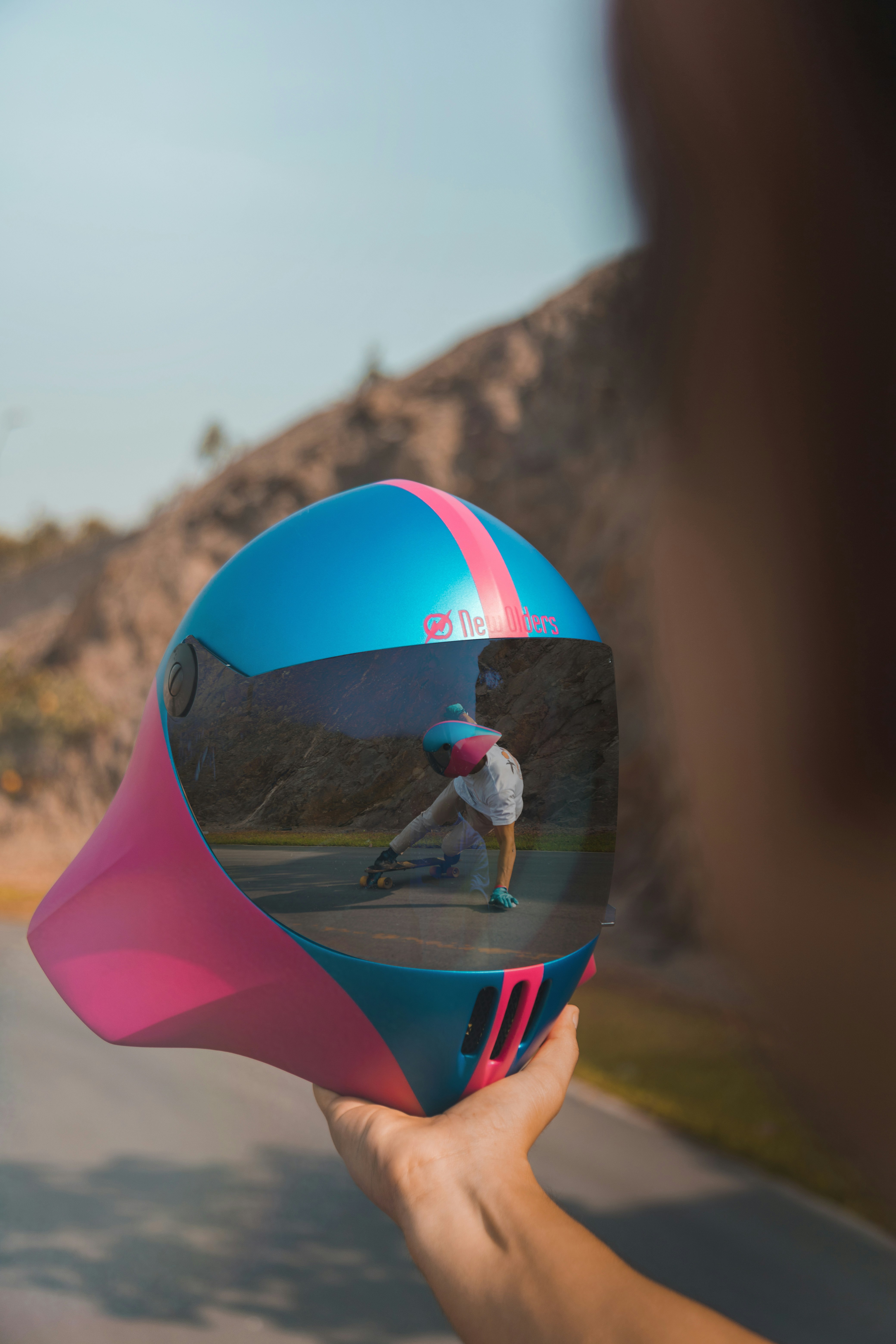 Neon Helmet Mirror: Roller Skater Reflected in a Pink-Blue Visor