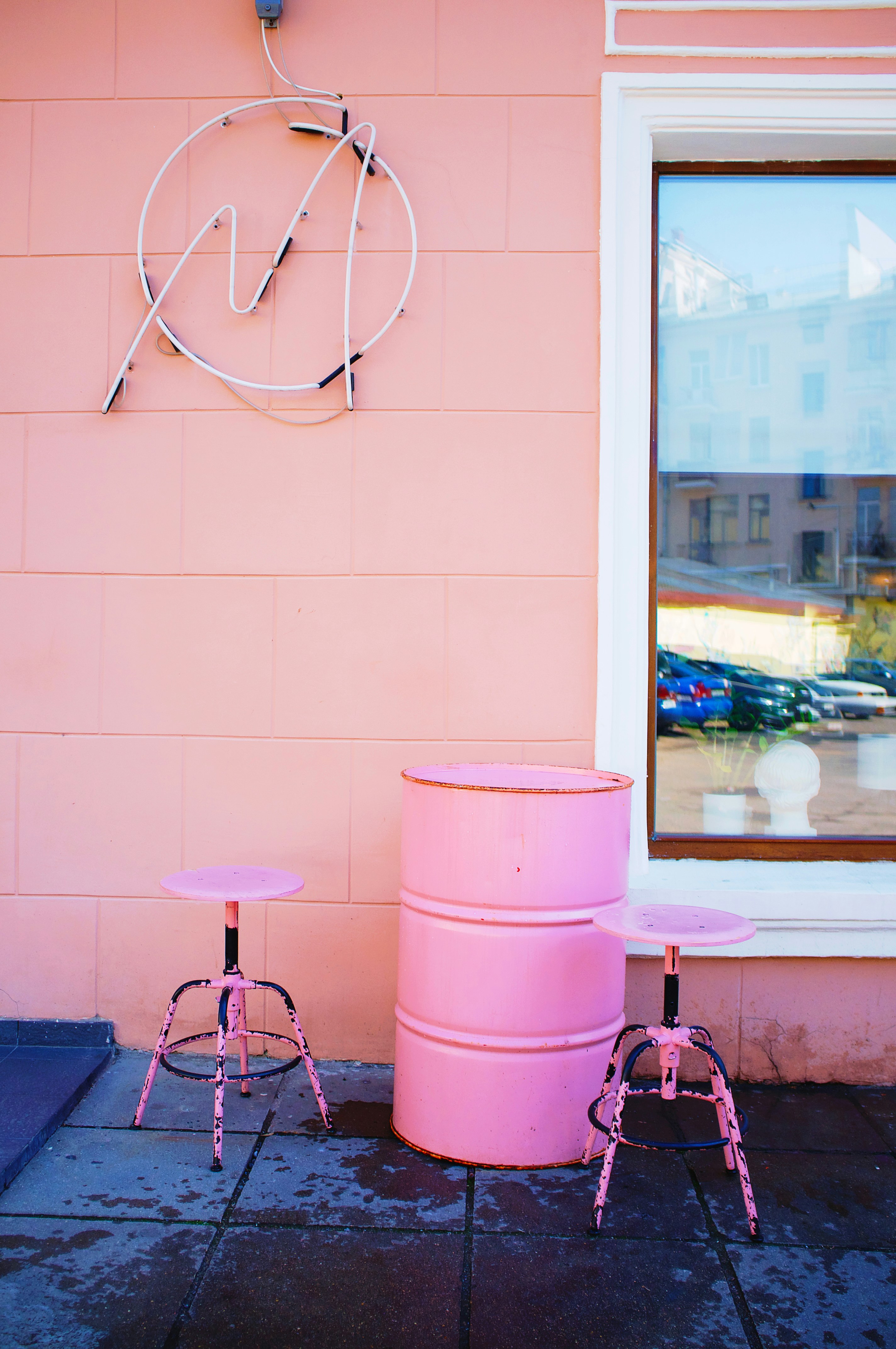 Pastel Neon and Pink Barrel: A Quiet Street Corner