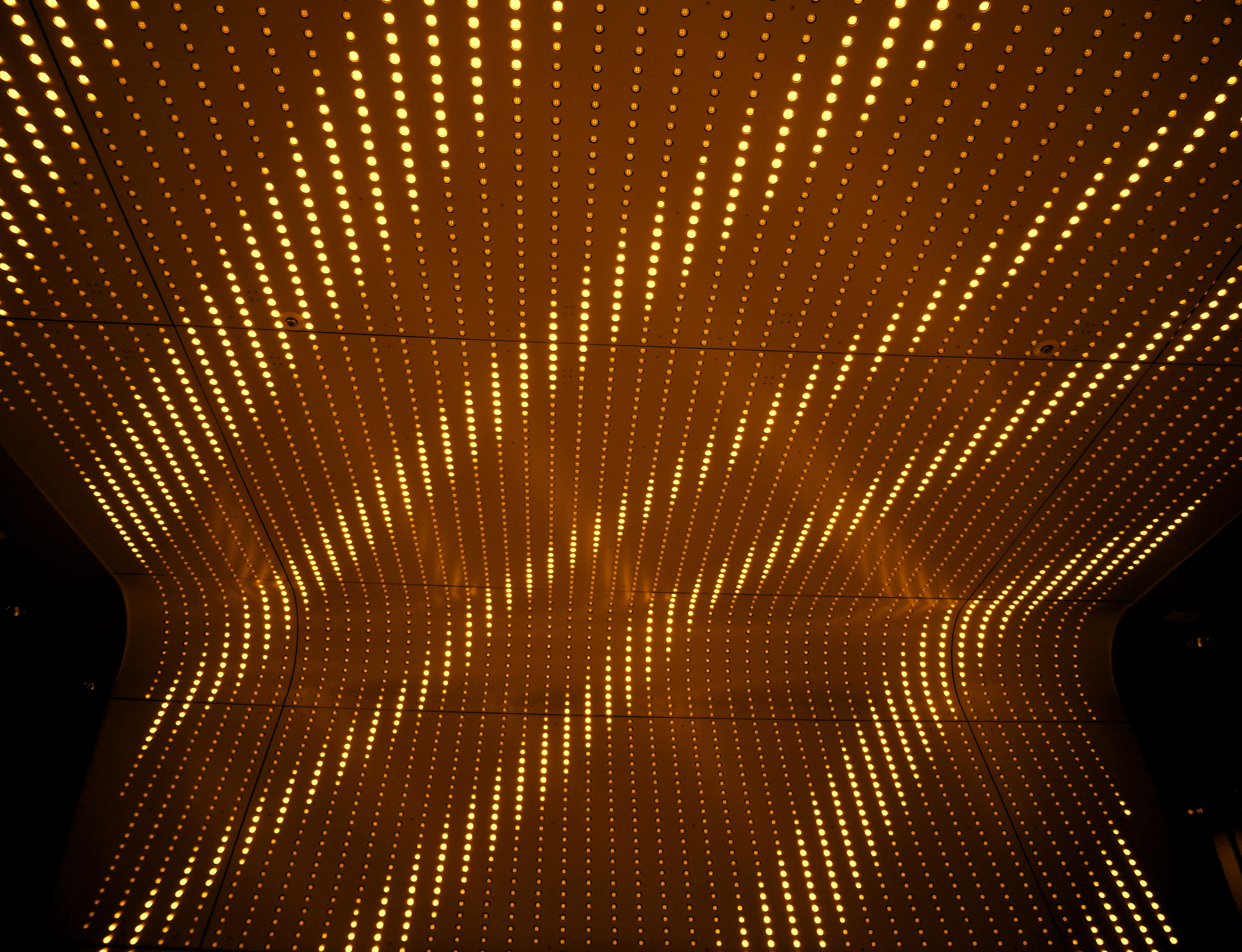 Electric Mirror: Grid of Warm Dots in a Dark Chamber