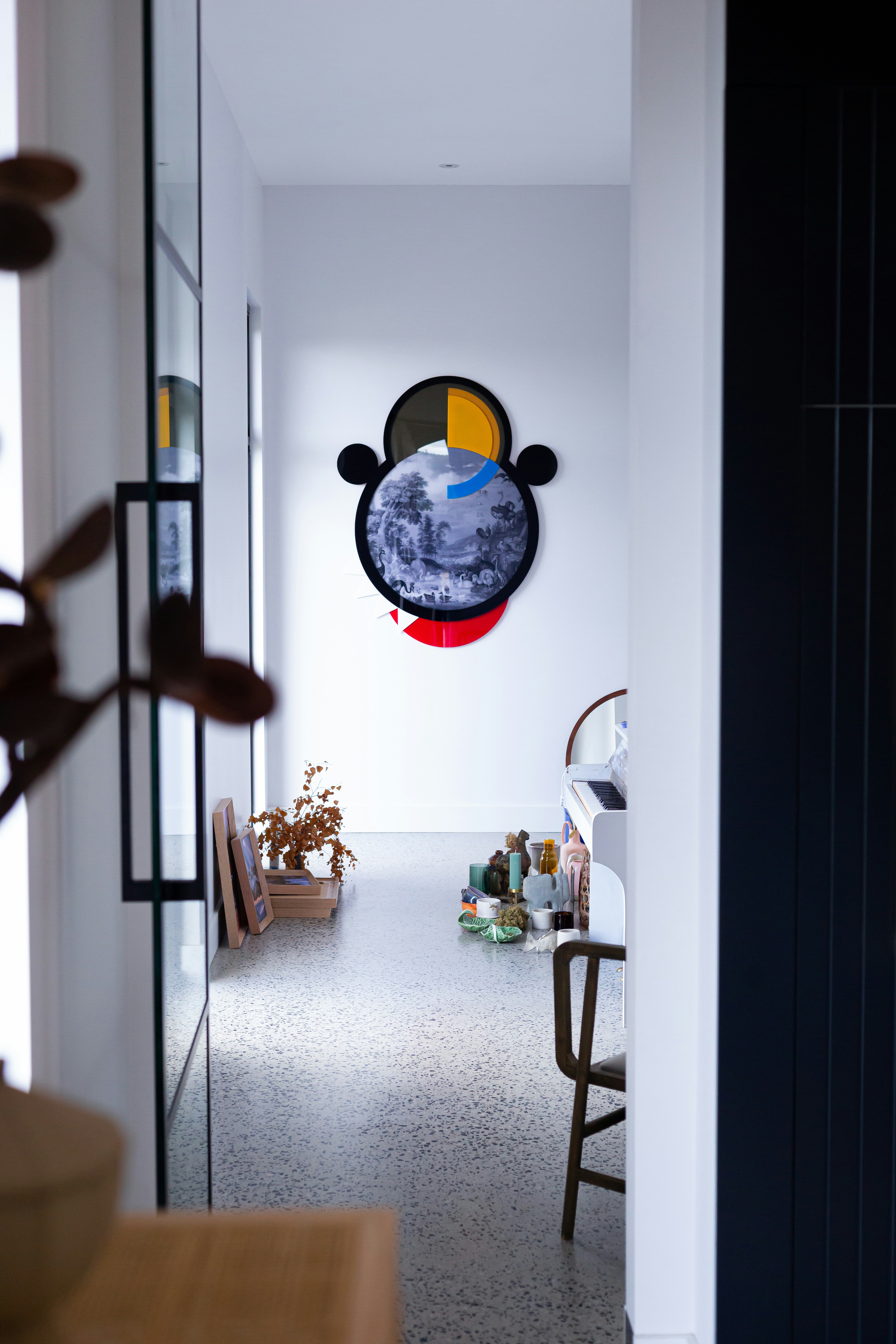 Concentric Moment: Bold Circular Artwork Anchoring a Minimal Hallway