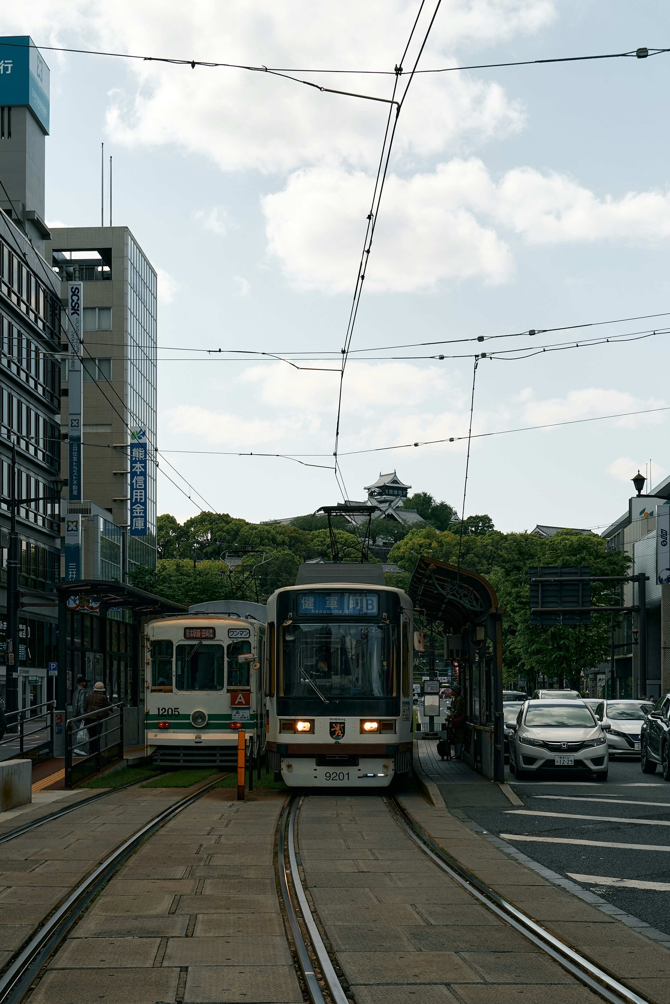 Yellow and black tram on road during daytime photo – Free Kumamoto ...