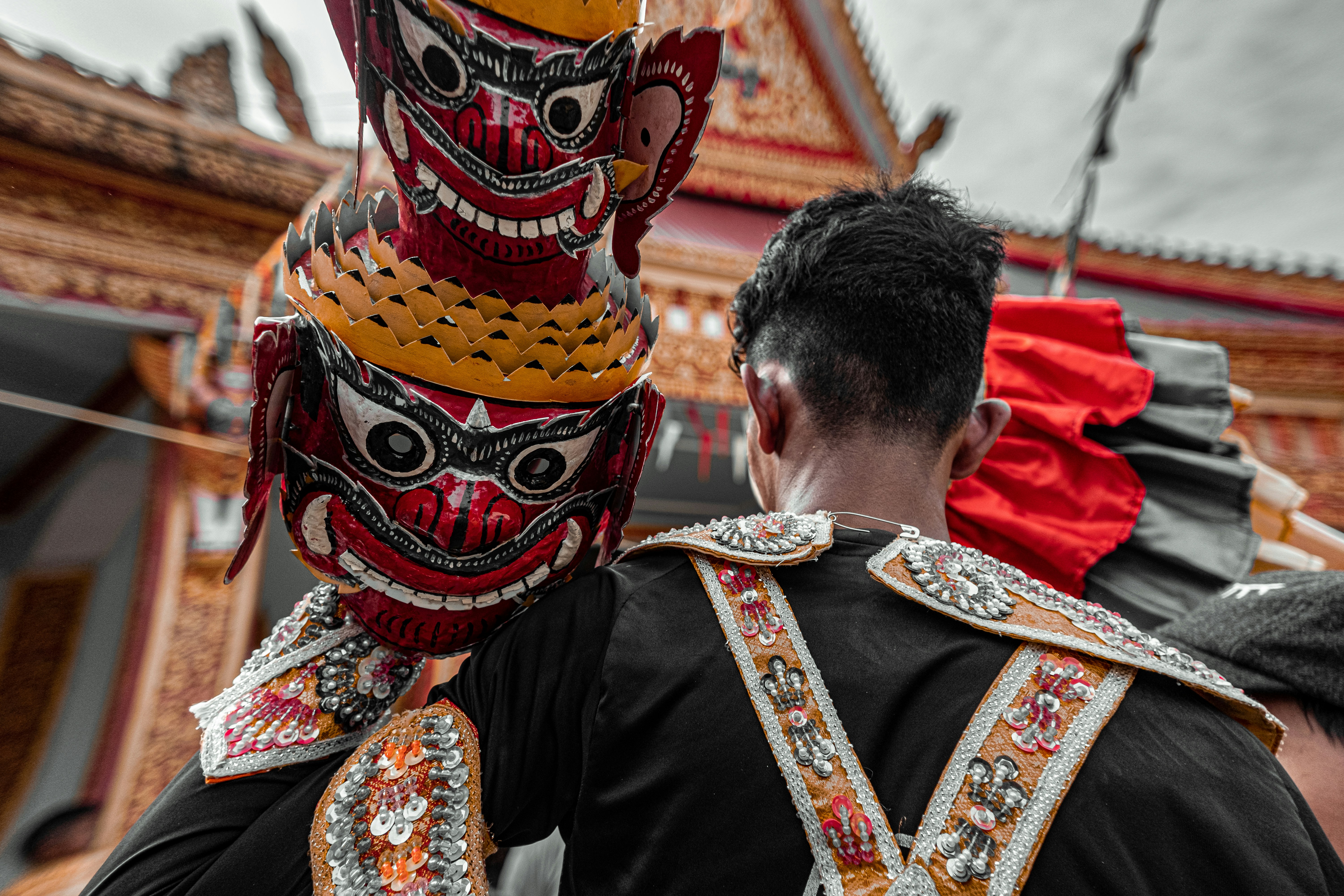 Man in black shirt wearing red and yellow mask photo – Free Long phú ...