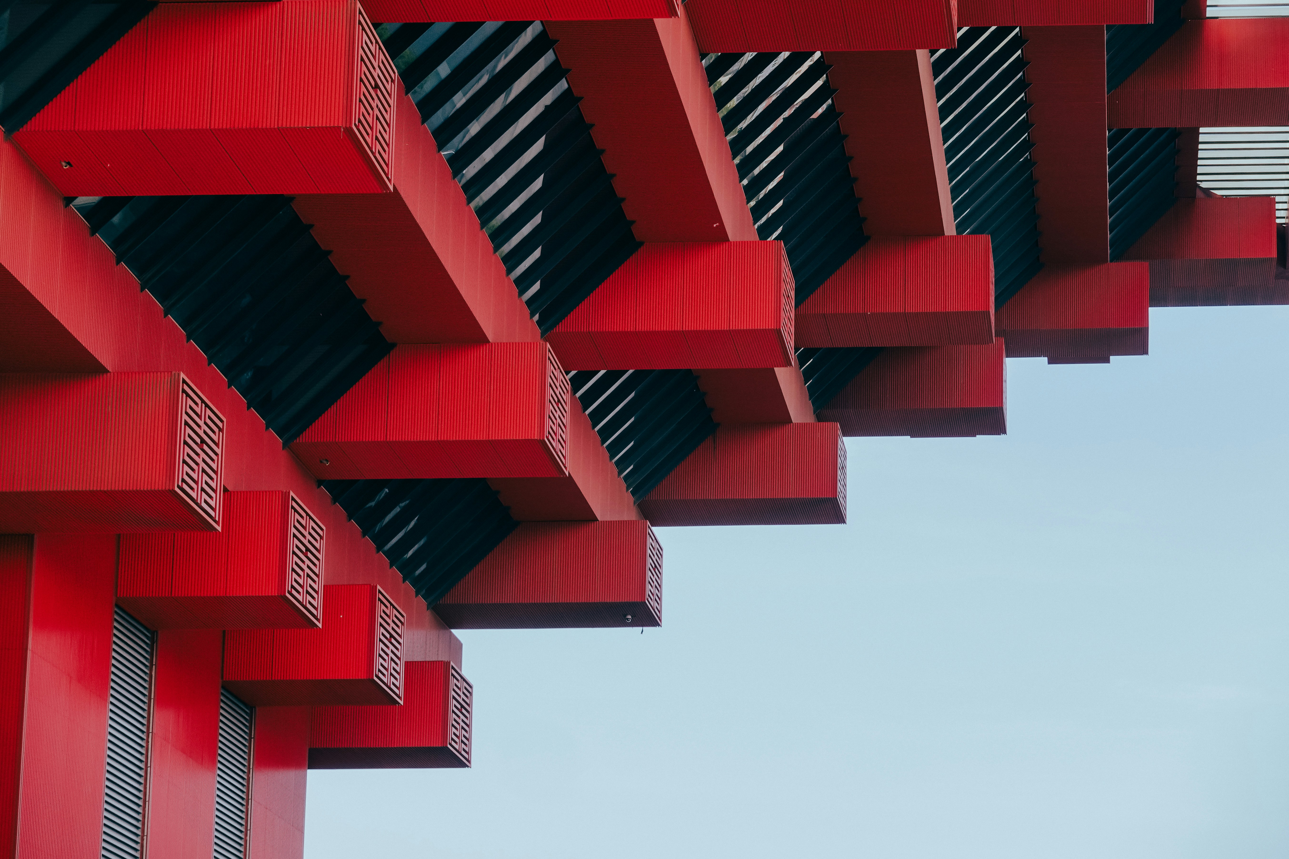 Red concrete building during daytime photo – Free Building Image on ...