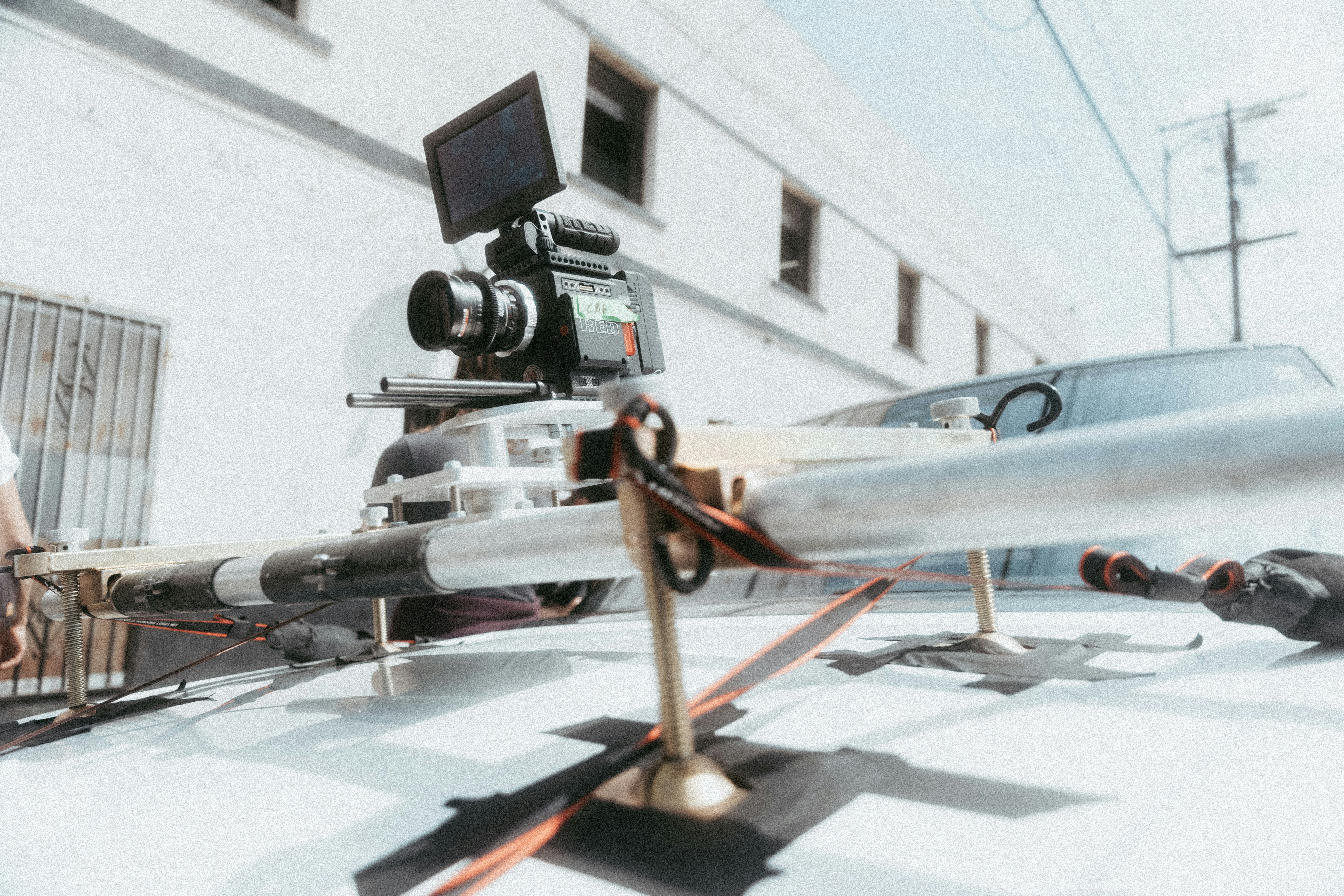 Rooftop Rig: The Cinema Camera Poised on a Sunlit Track