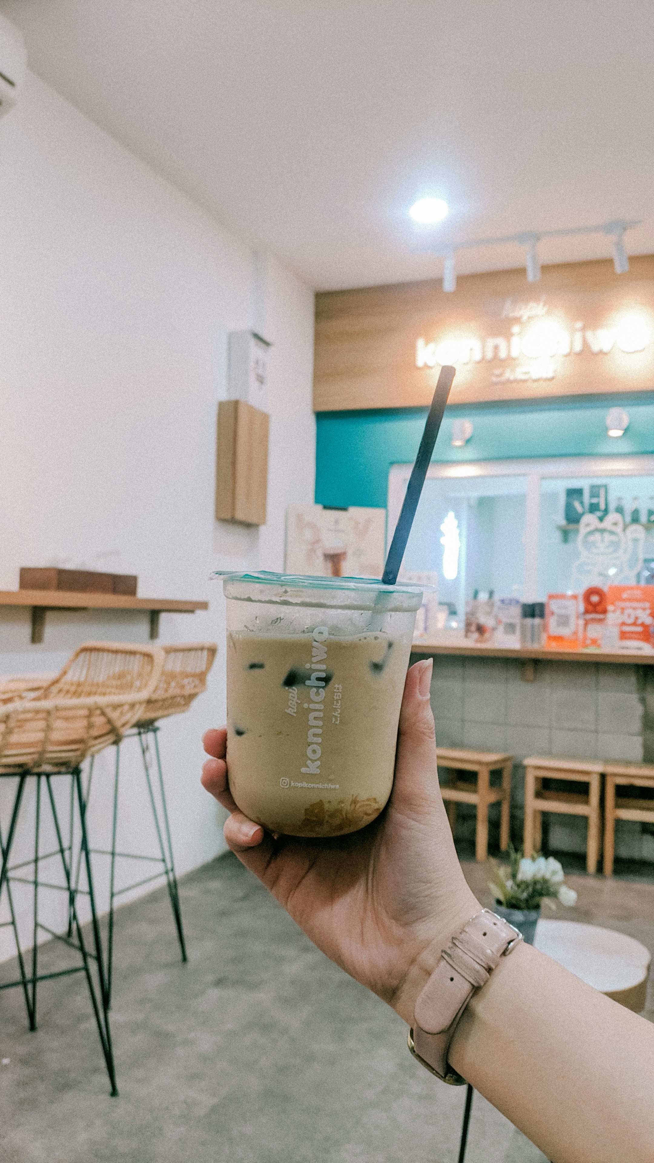person holding clear plastic cup