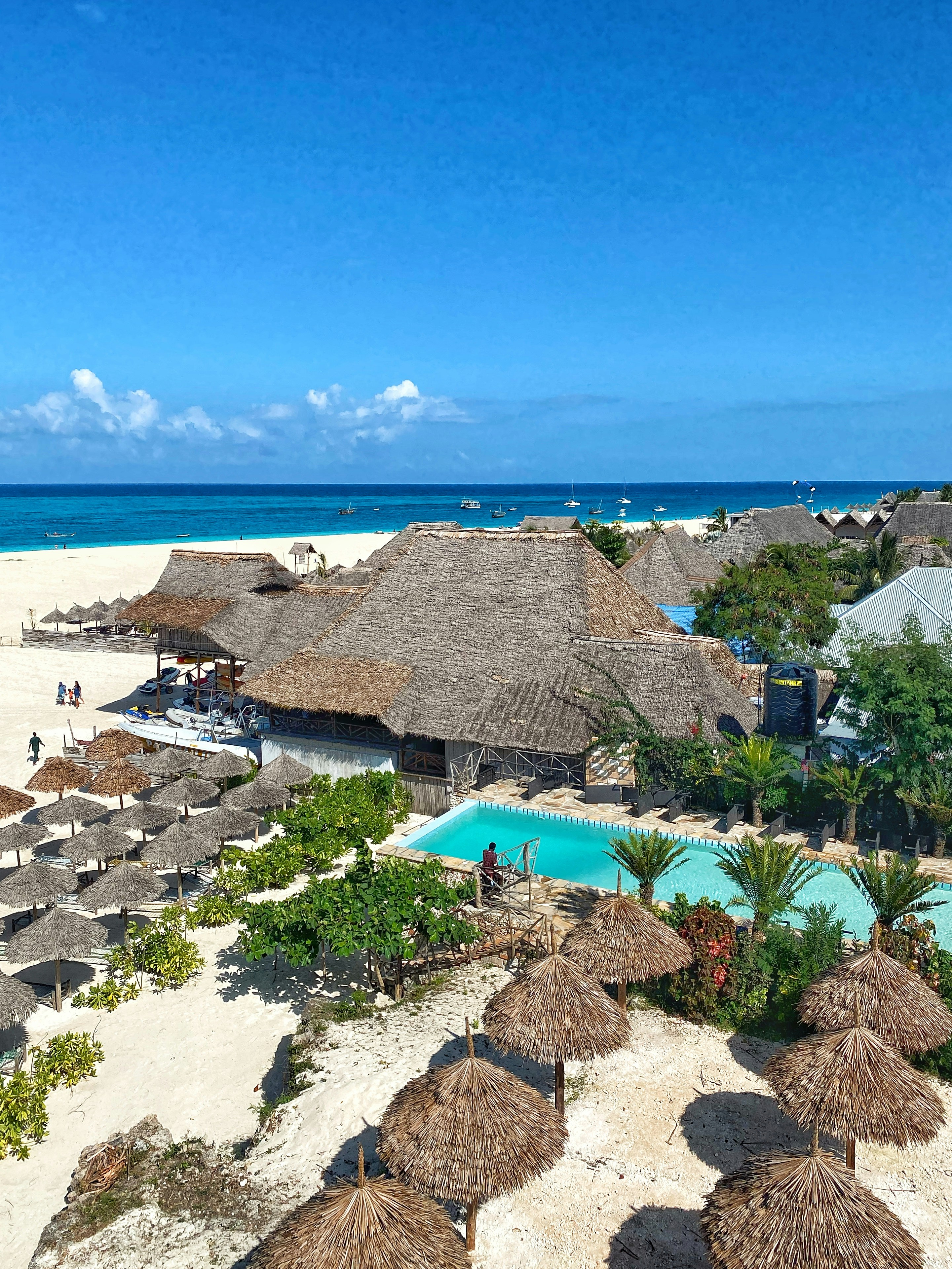 Azure Oasis Beyond the Thatch: A Coastal Village Retreat