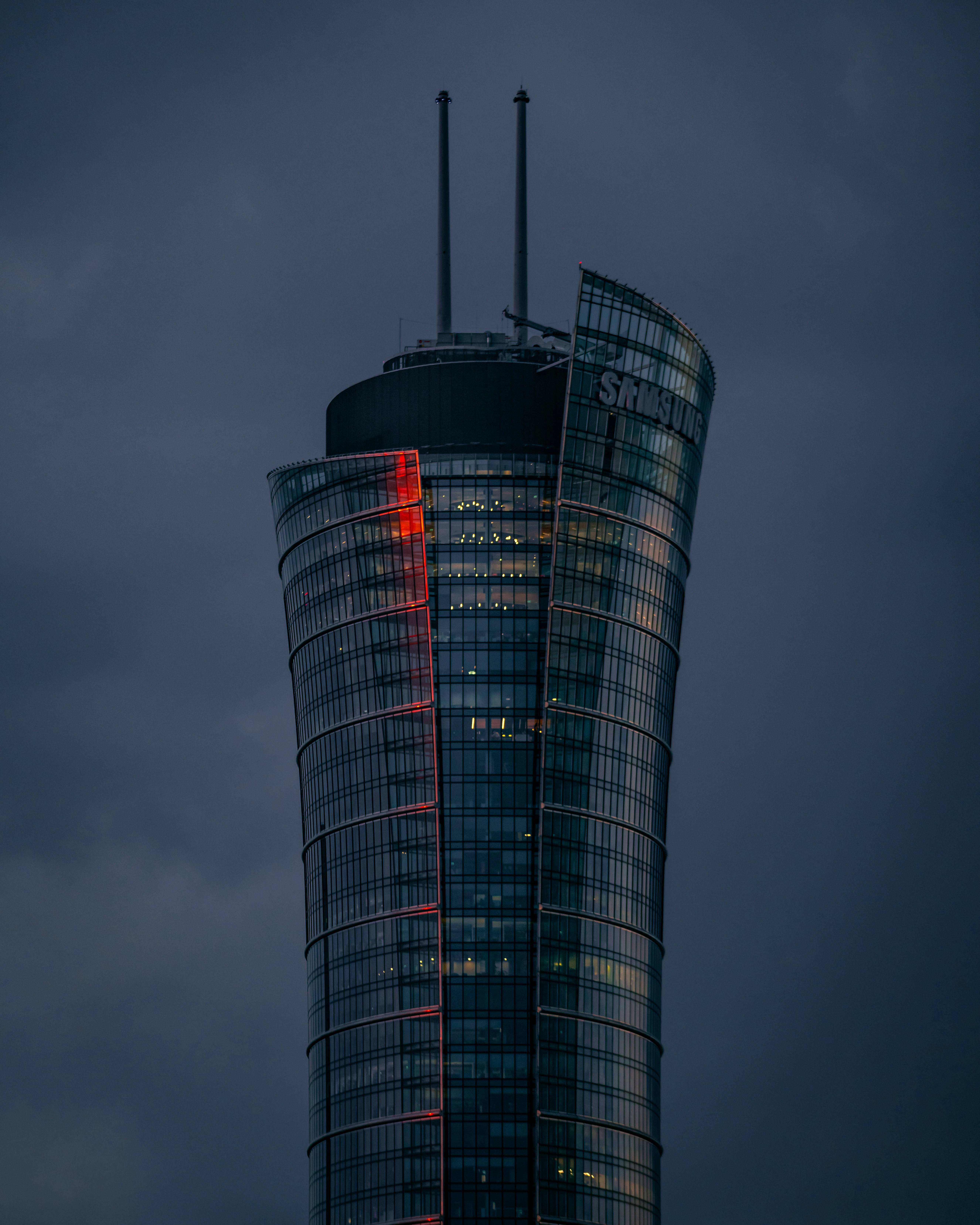 One of the most characteristic skyscrapers in Warsaw - Warsaw Spire. It has a very eye-catching architecture and stands in the most dynamically developing place in Warsaw - Daszyńskiego roundabout. I managed to capture it in the last rays of the setting red spring sun.