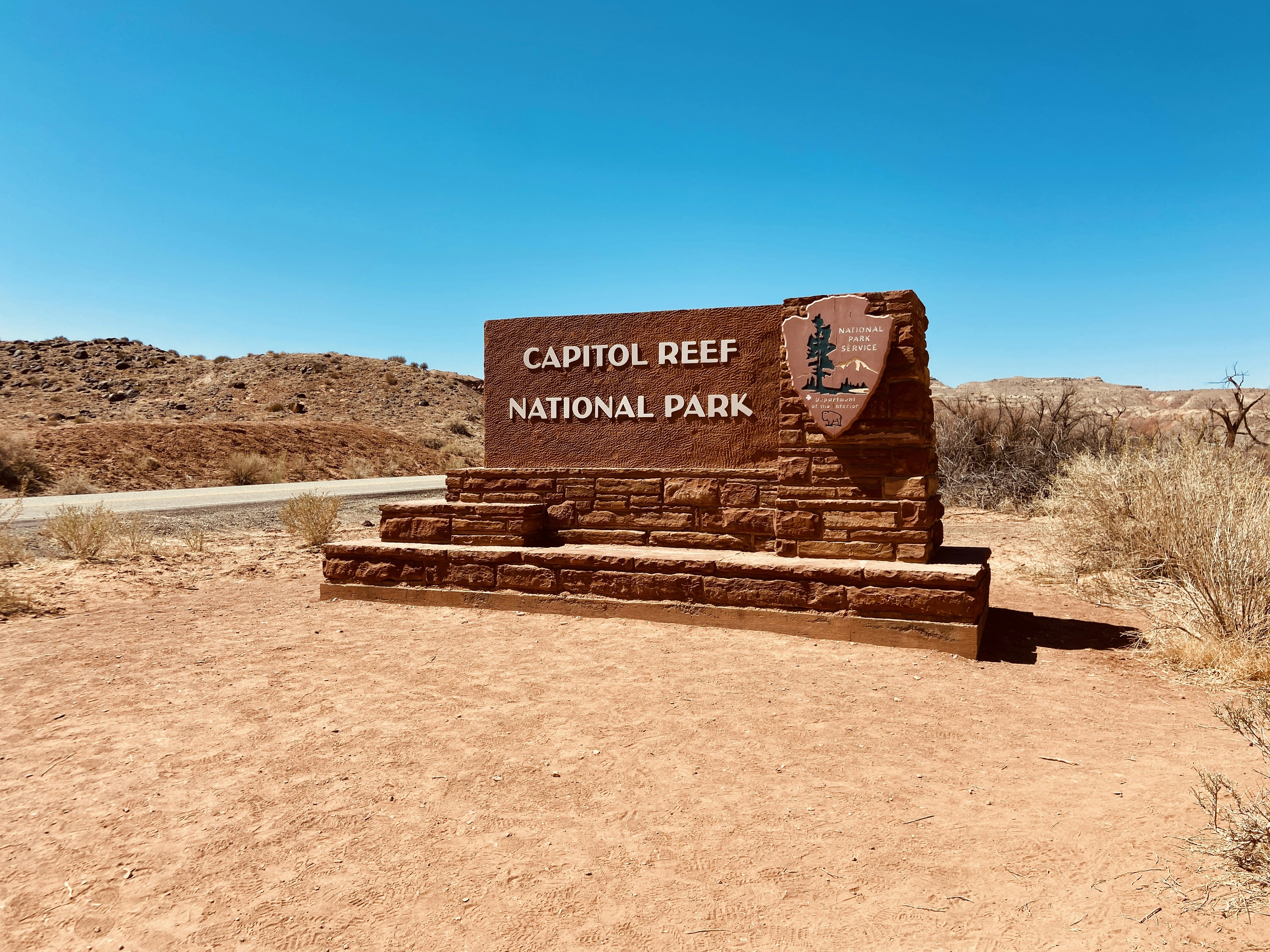 Capitol Reef's Stone Sign: A Quiet Welcome on Sun-Soaked Red Desert