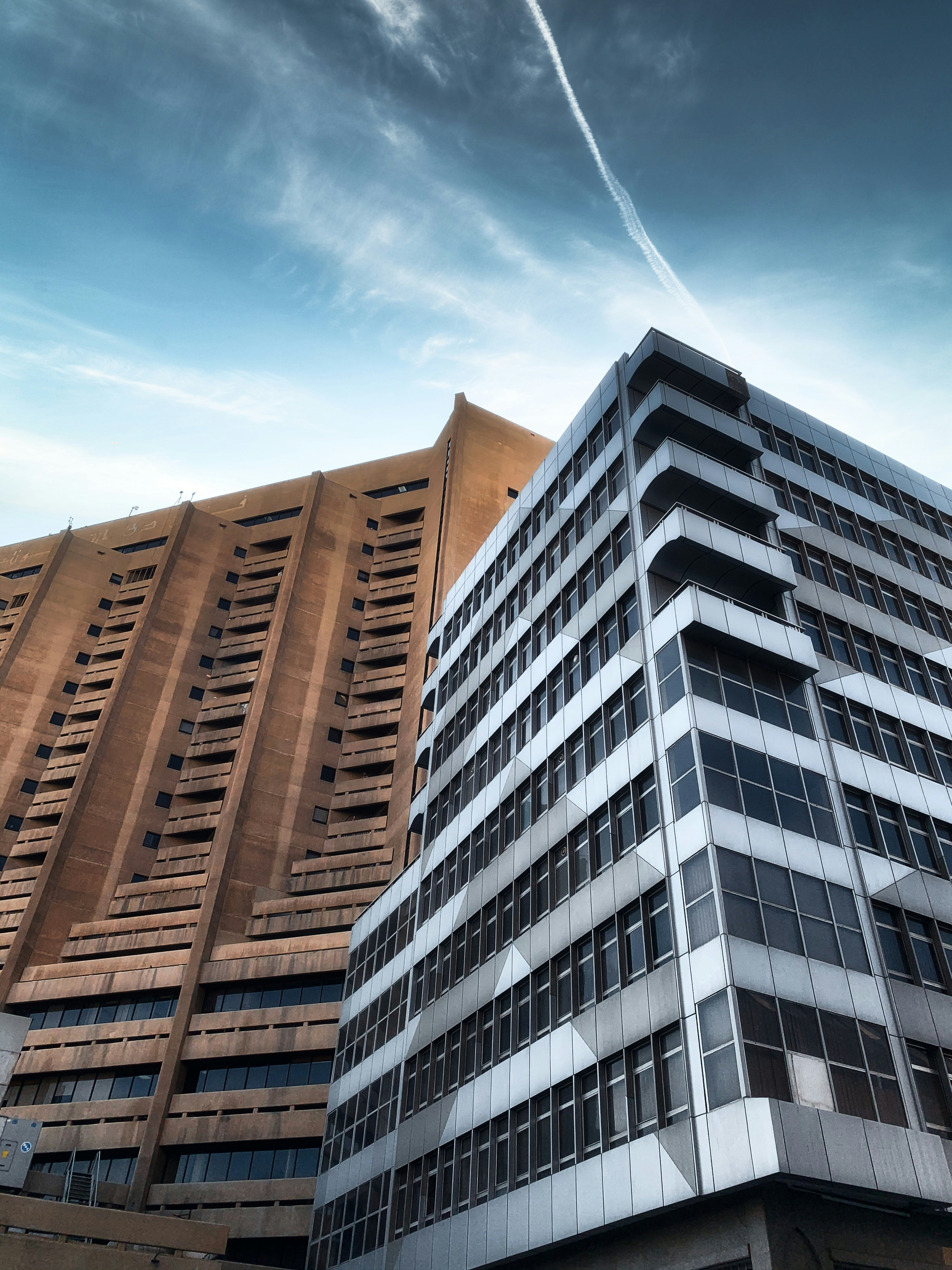 White and black concrete building under blue sky during daytime photo ...