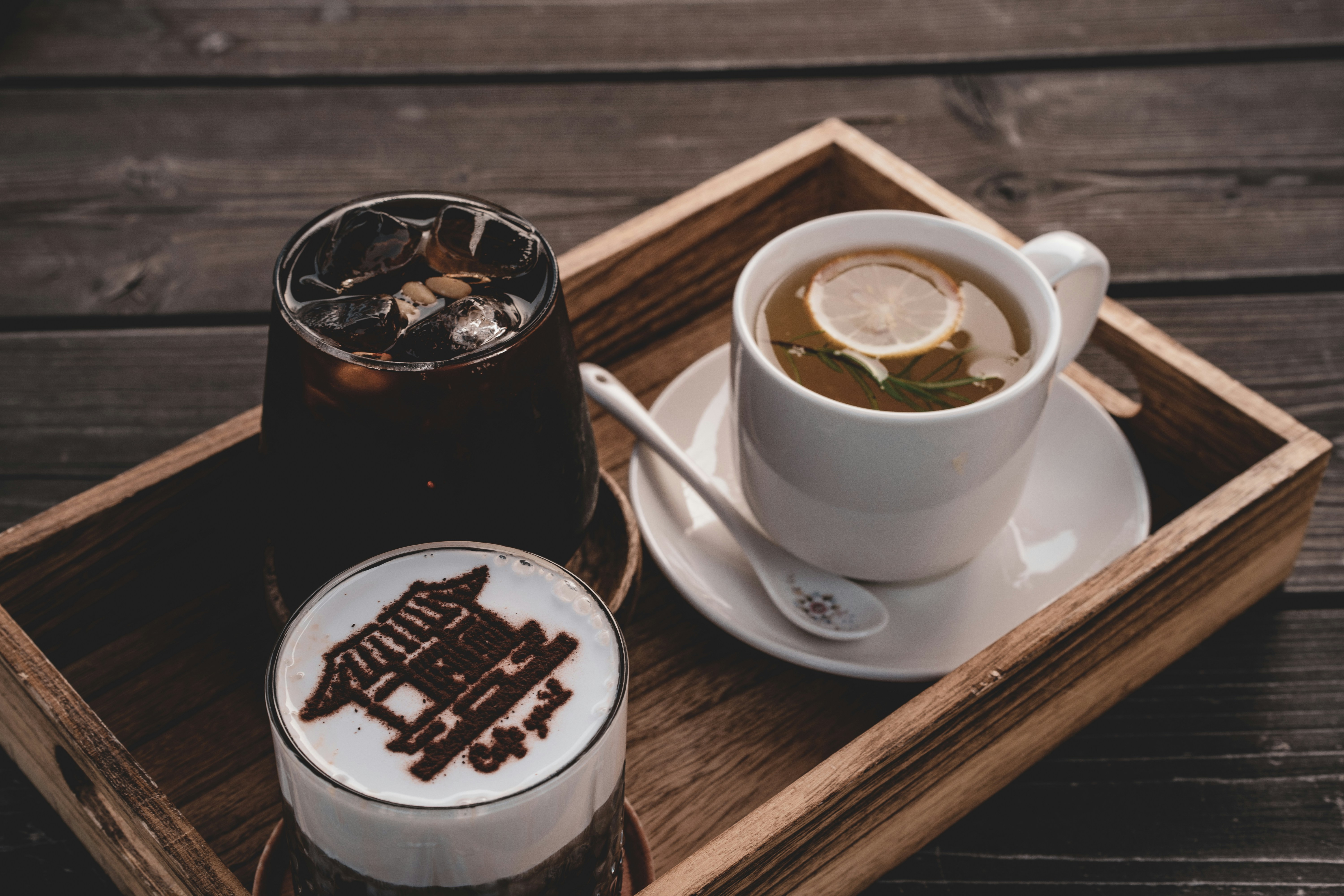 Foam Glyphs, Iced Coffee, and Lemon Tea on a Weathered Tray