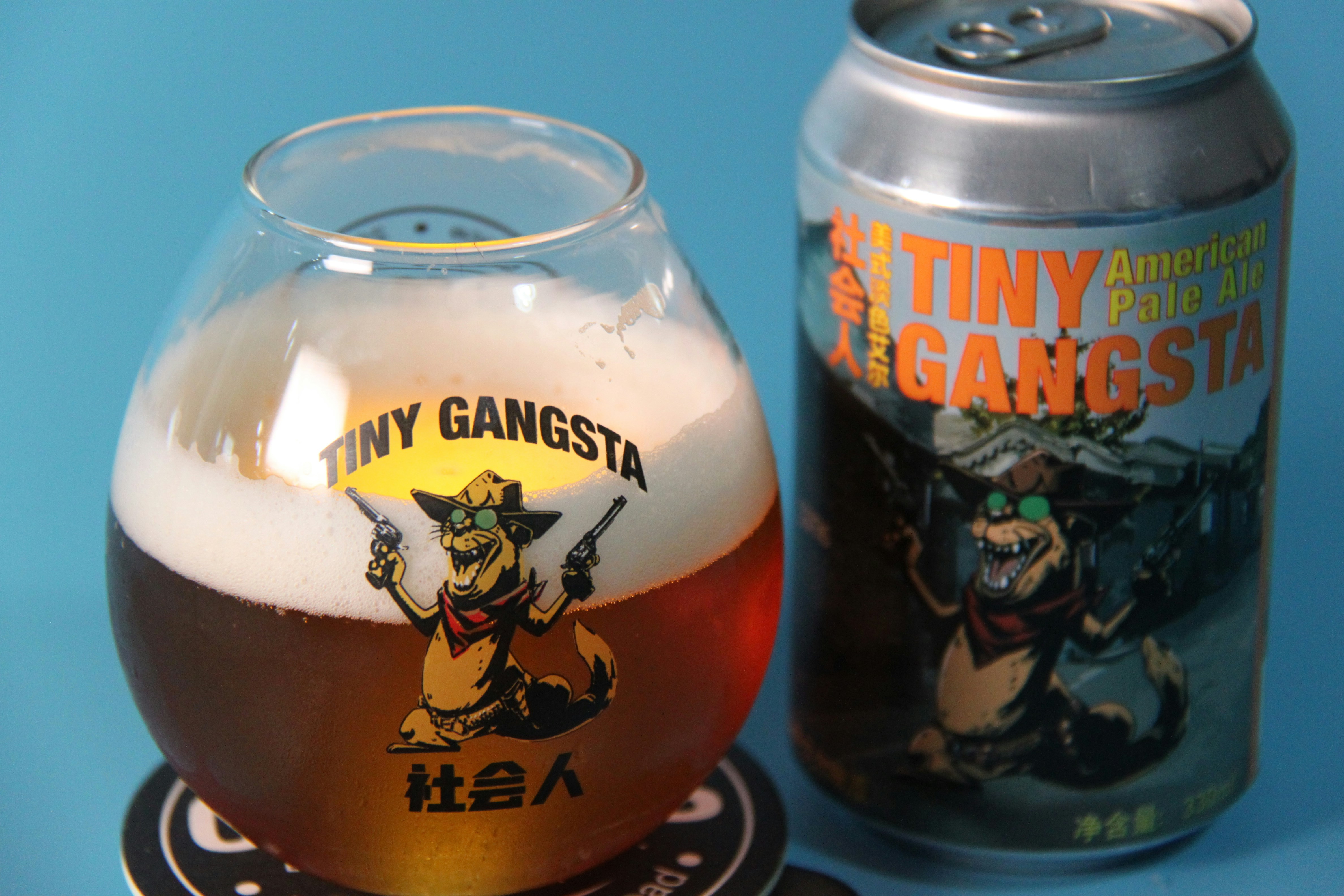 Tiny Gangsta Duo: Cartoon Beer Label Shines on Teal Backdrop