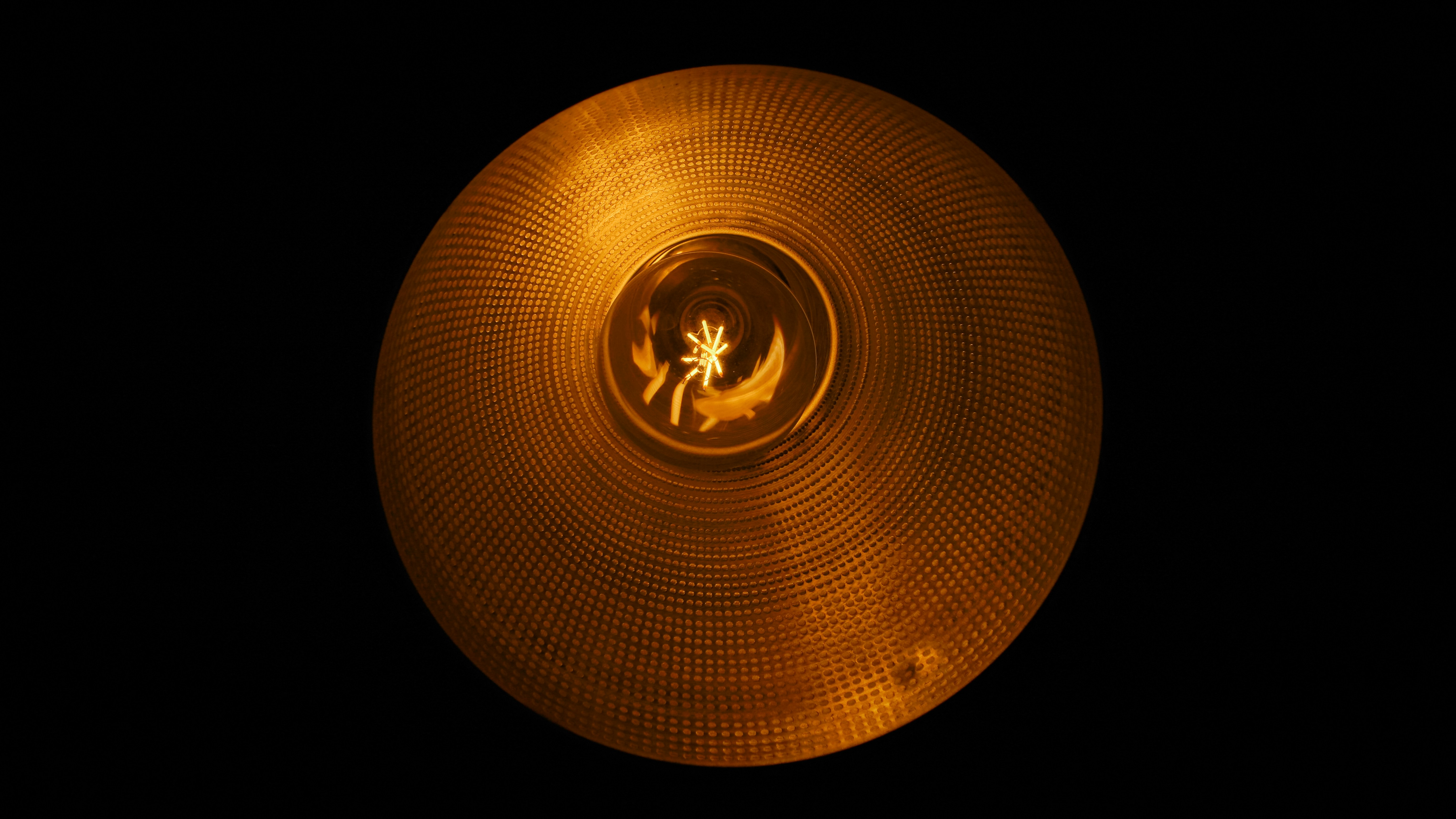 Ember Center: Close-Up of an Amber Lightbulb