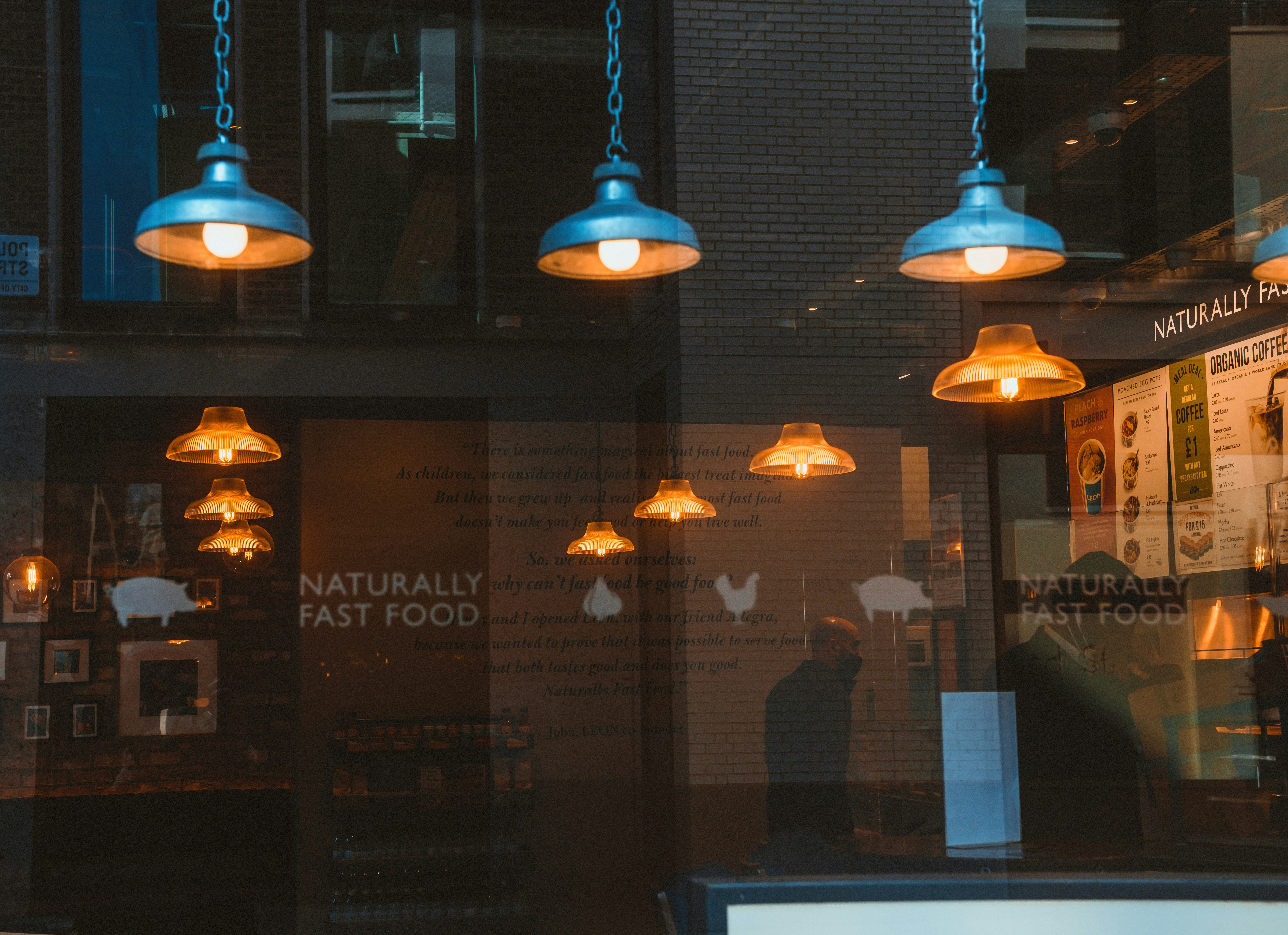 Warm Industrial Glow Over a Quiet Fast-Food Window