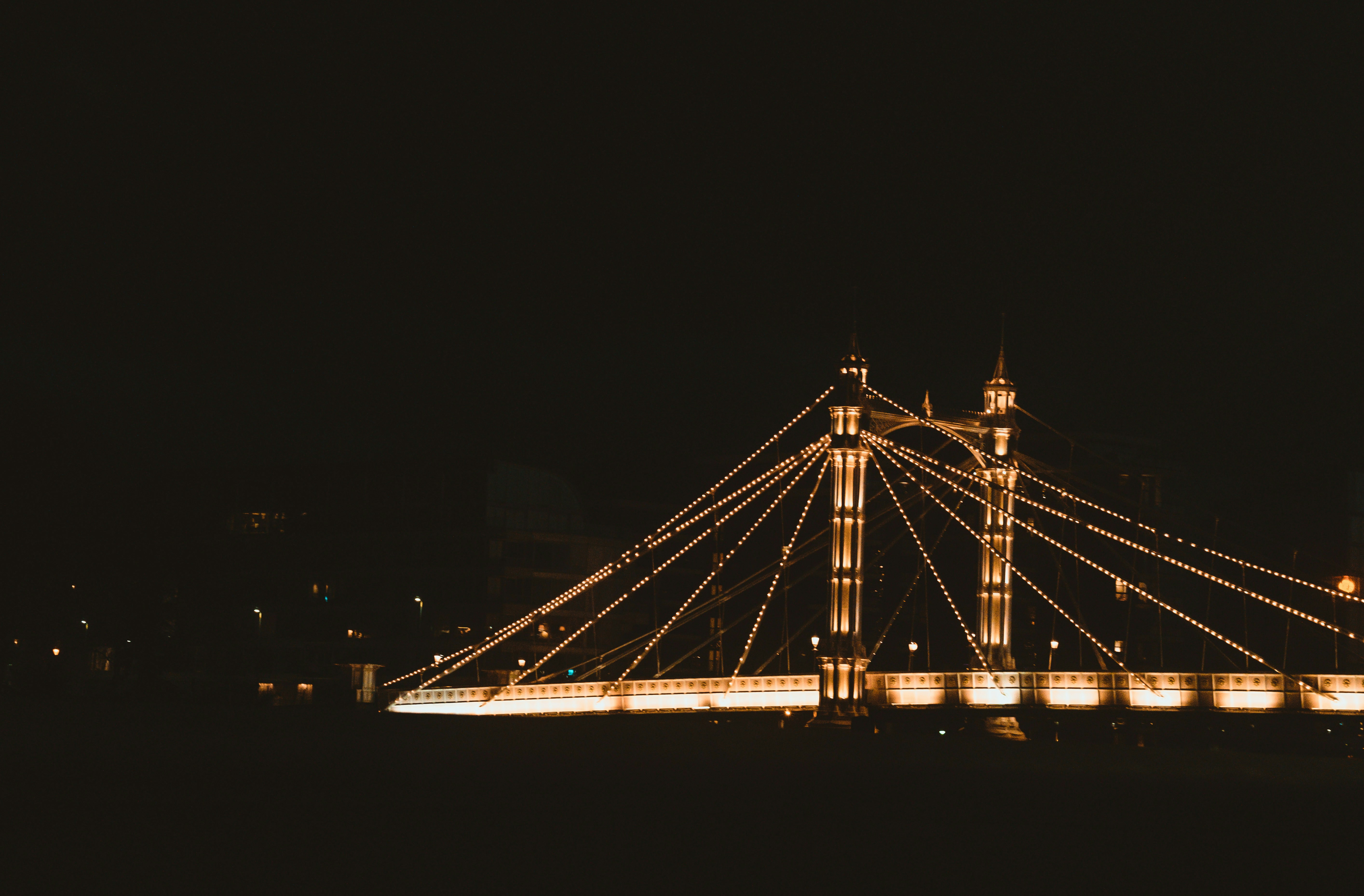 Golden Cables Over the River: Night Bridge Illumination