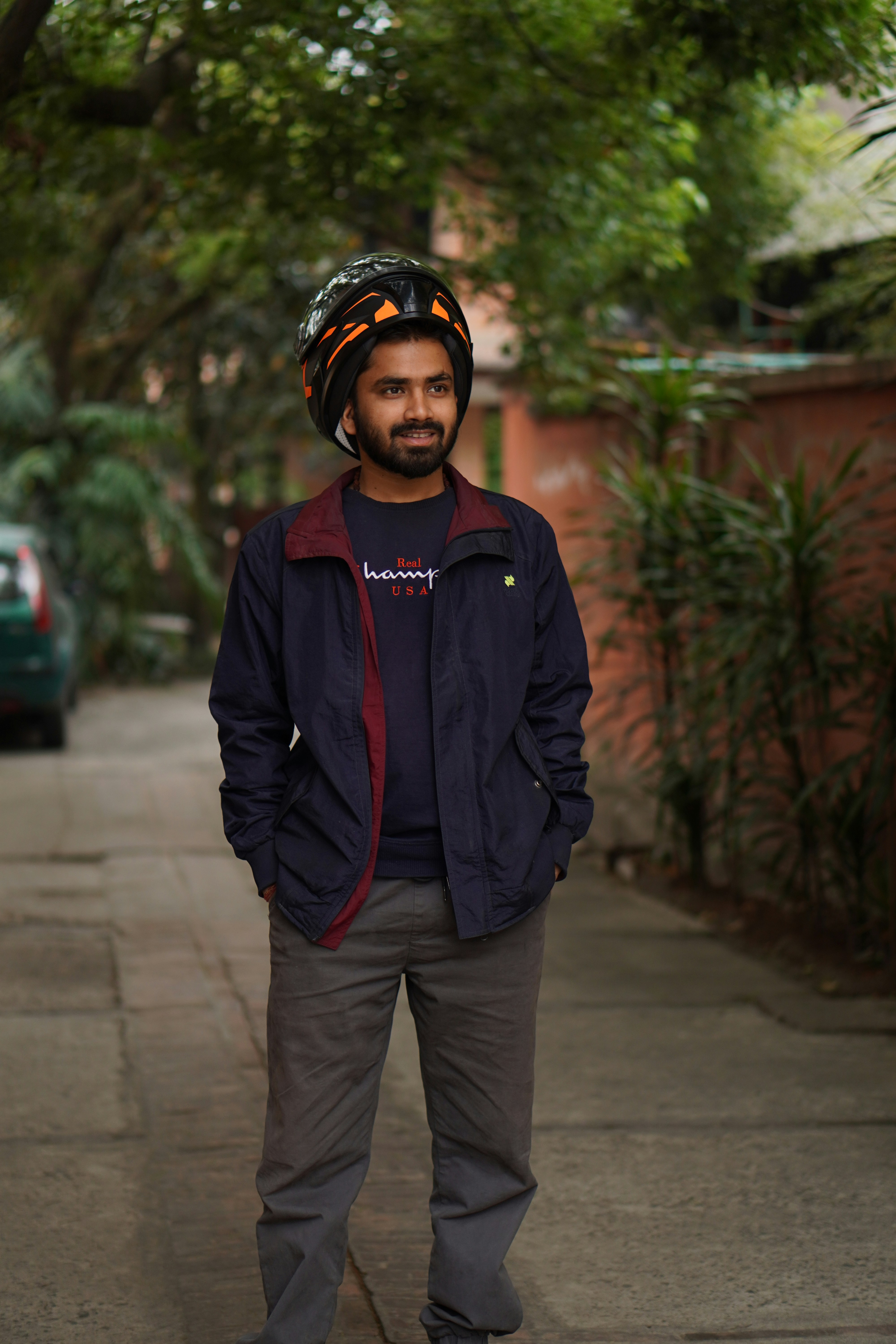 Casual Confidence: Portrait of a Rider in Quiet Urban Green
