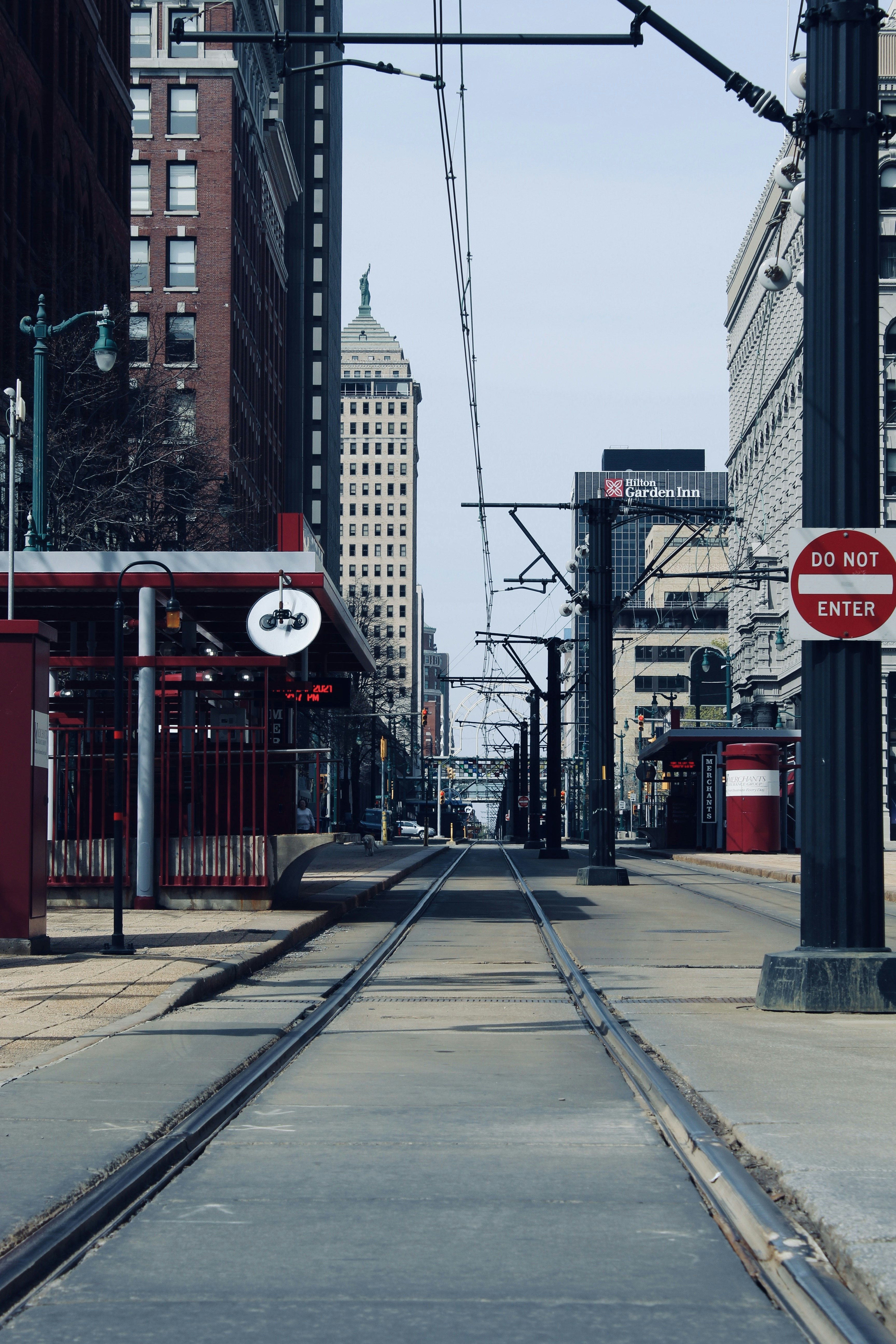 Vanishing Rails: A Quiet City Street Reaches for the Sky