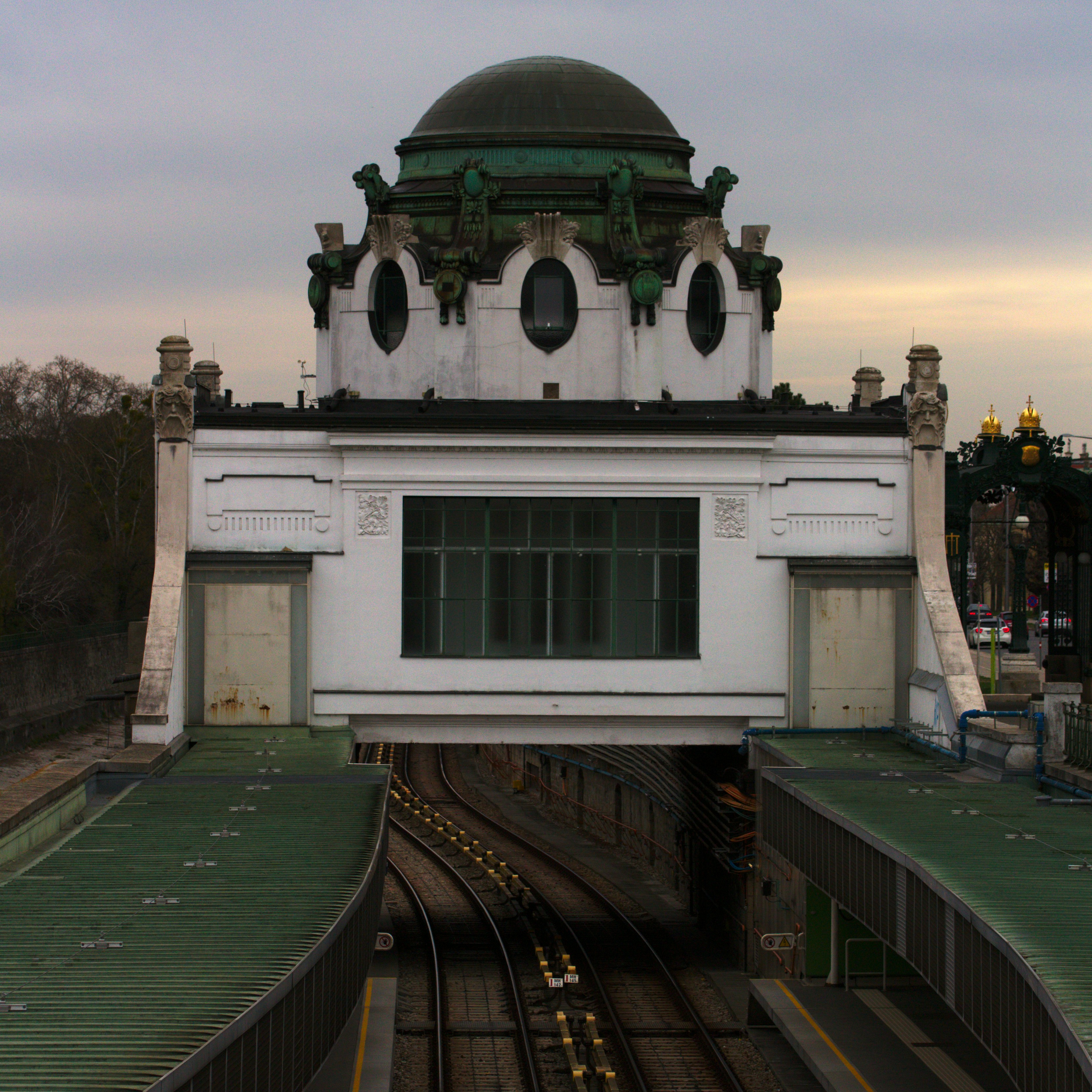 Historic transit station featuring an ornate dome and detailed façade, framed by the urban landscape. A testament to early 20th-century architecture.