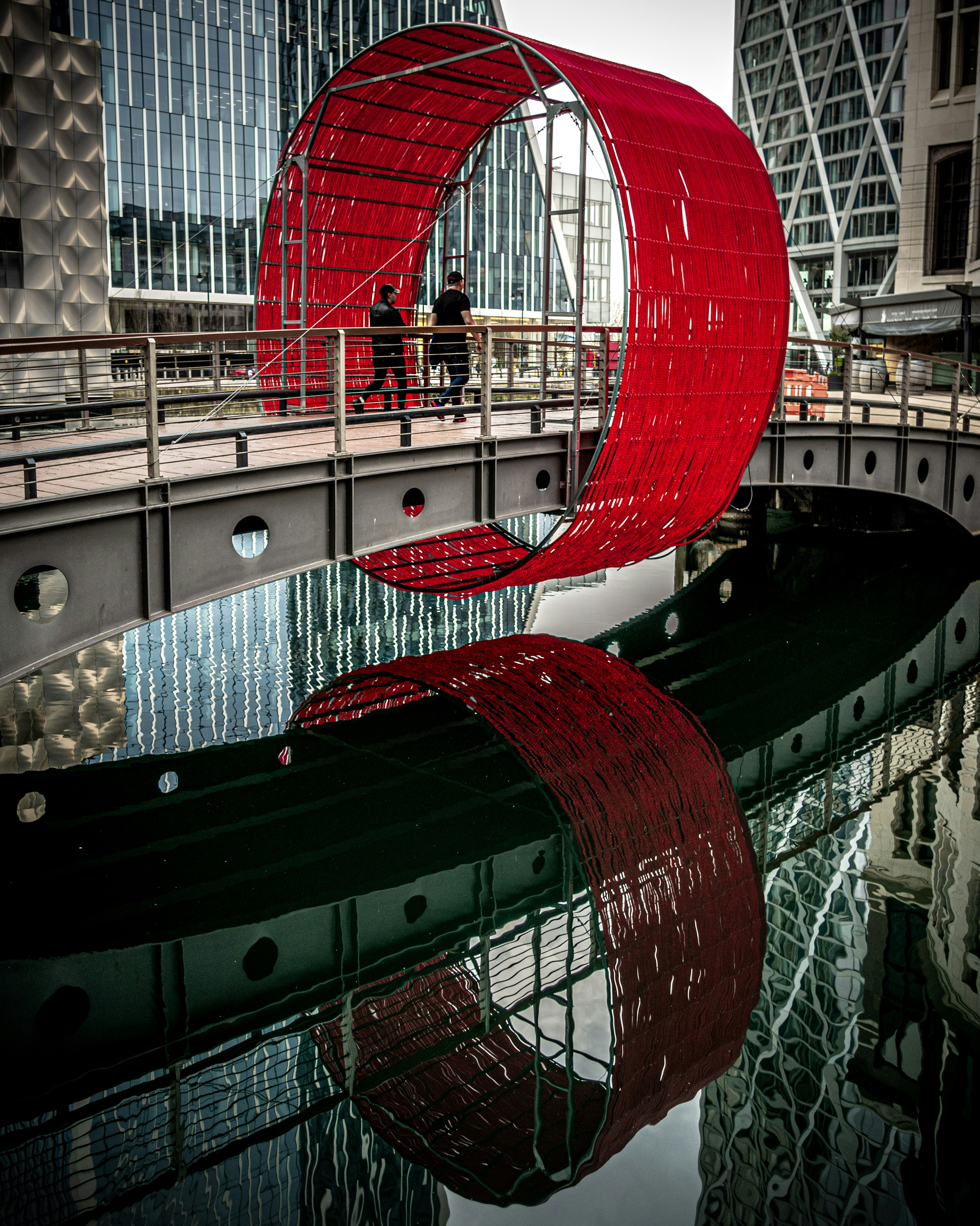 Crimson Loop Over Glass and Water