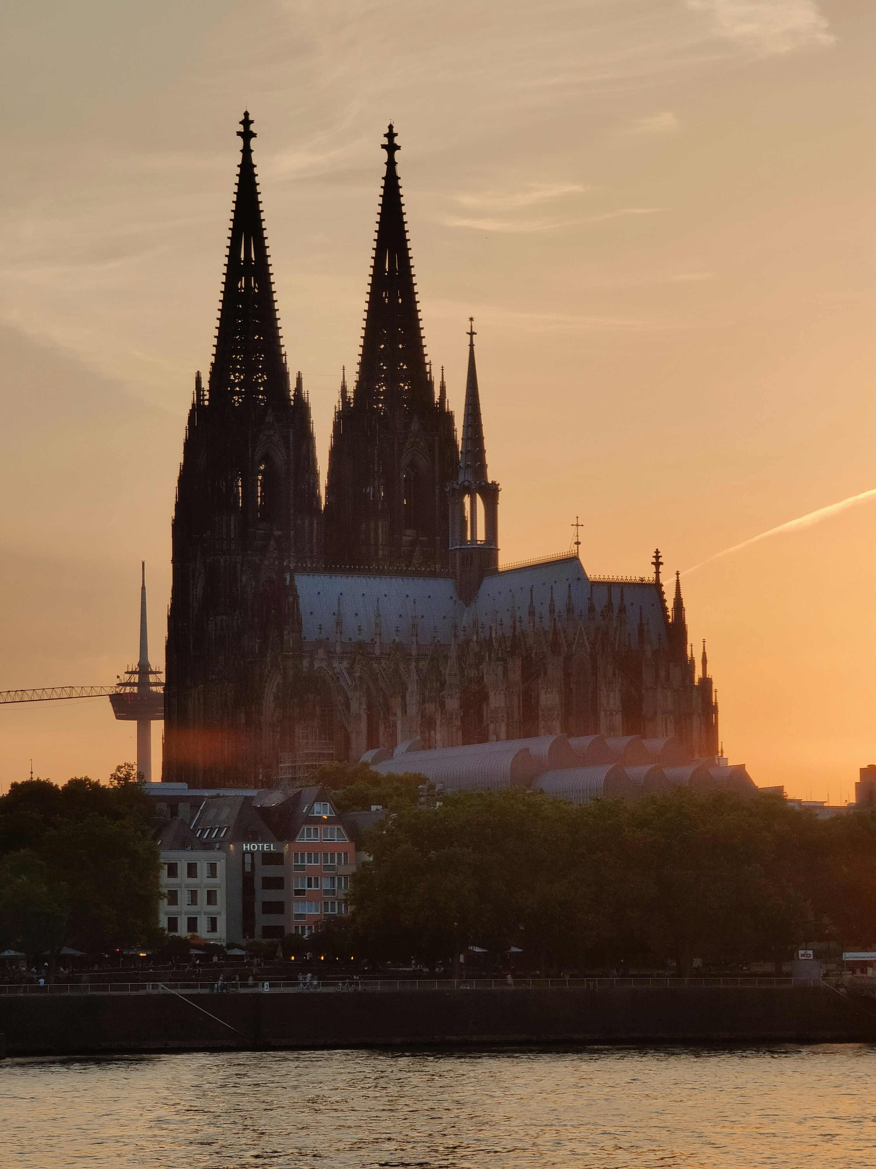 Twin Gothic Spires Crown the Rhine at Sunset
