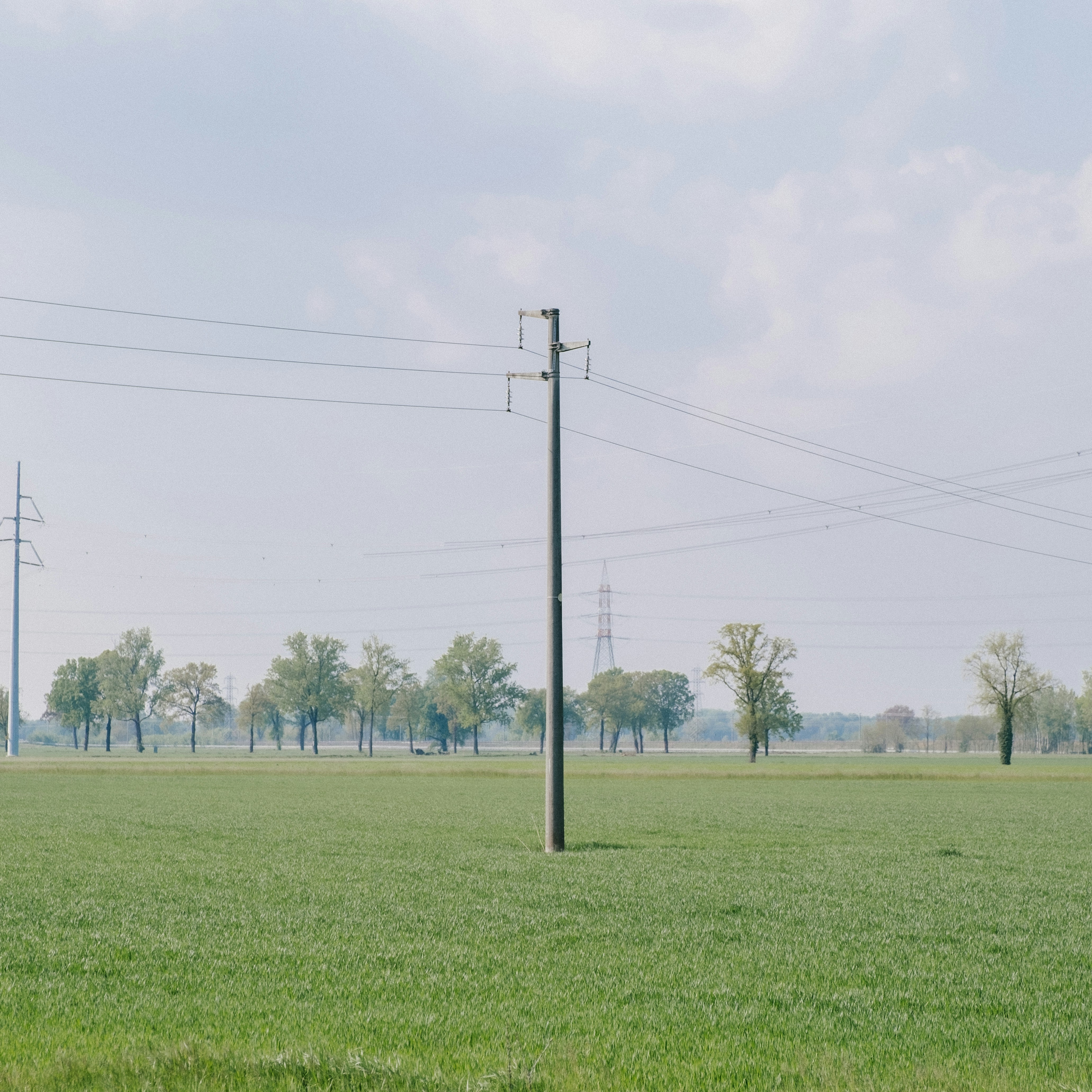 The Quiet Grid: A Standalone Power Pole Halving a Vast Prairie