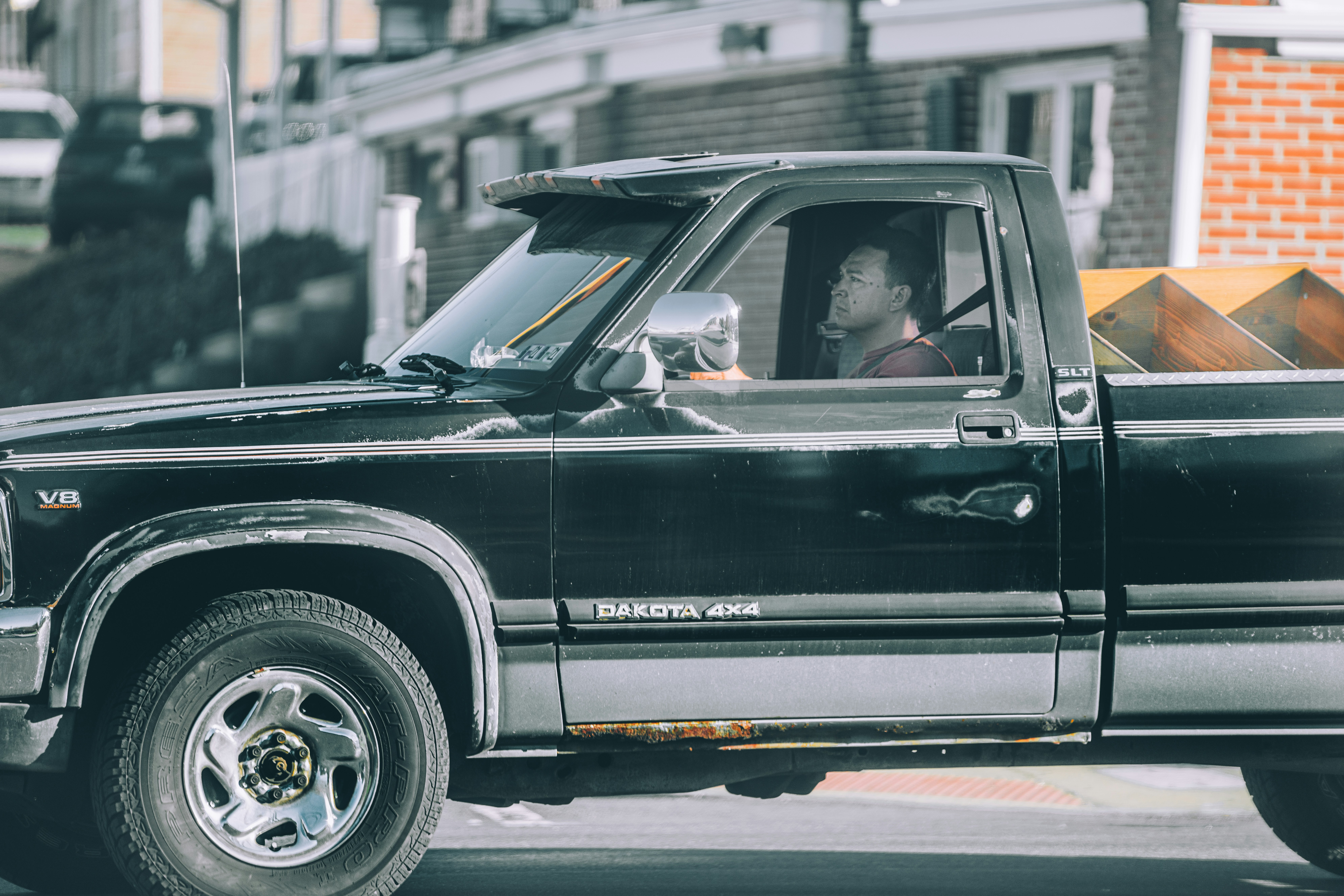 Dark Green Dakota Pickup, Quiet Driver in Focus