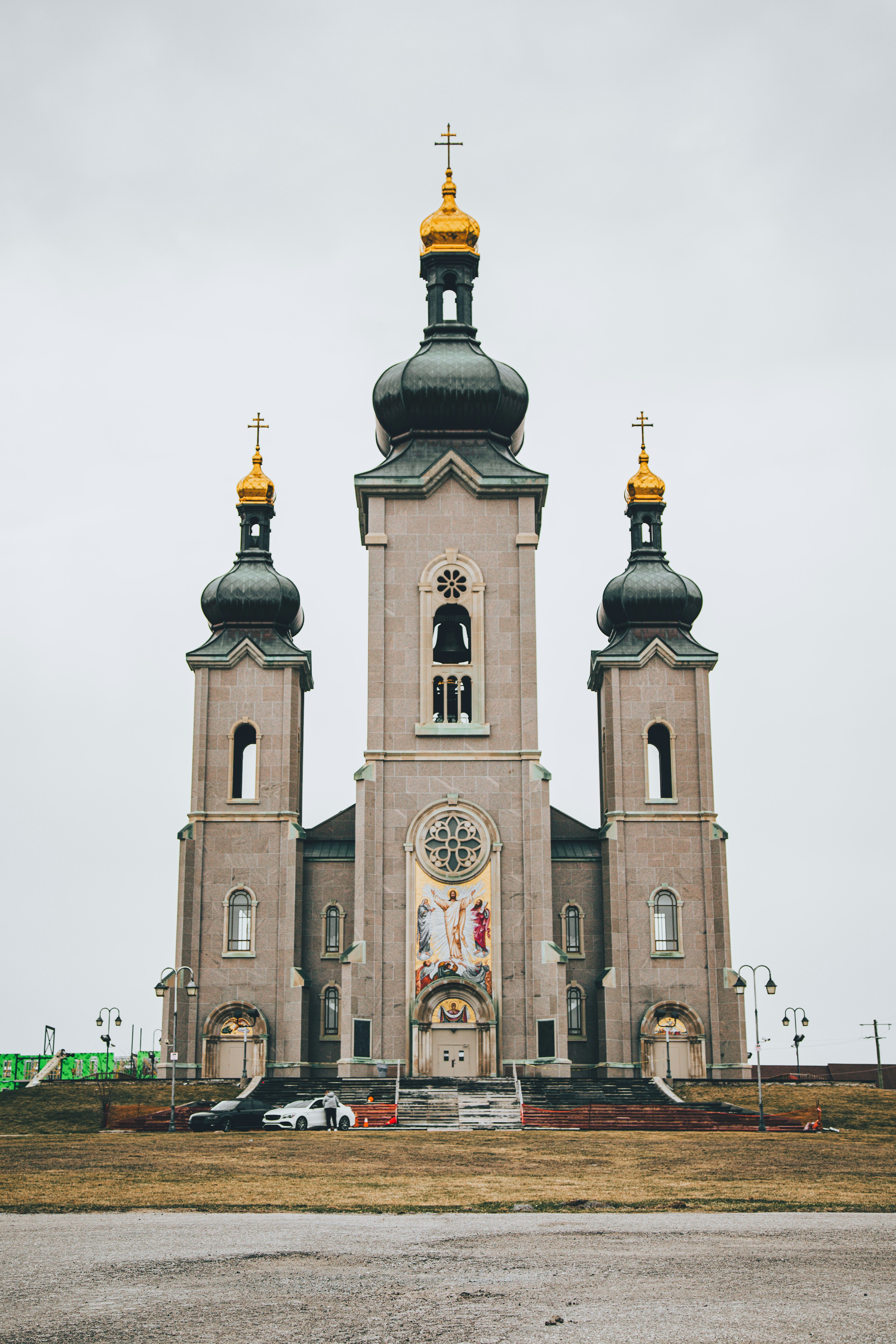 Triple-Spired Cathedral: Central Dome Rising Above a Pale Sky