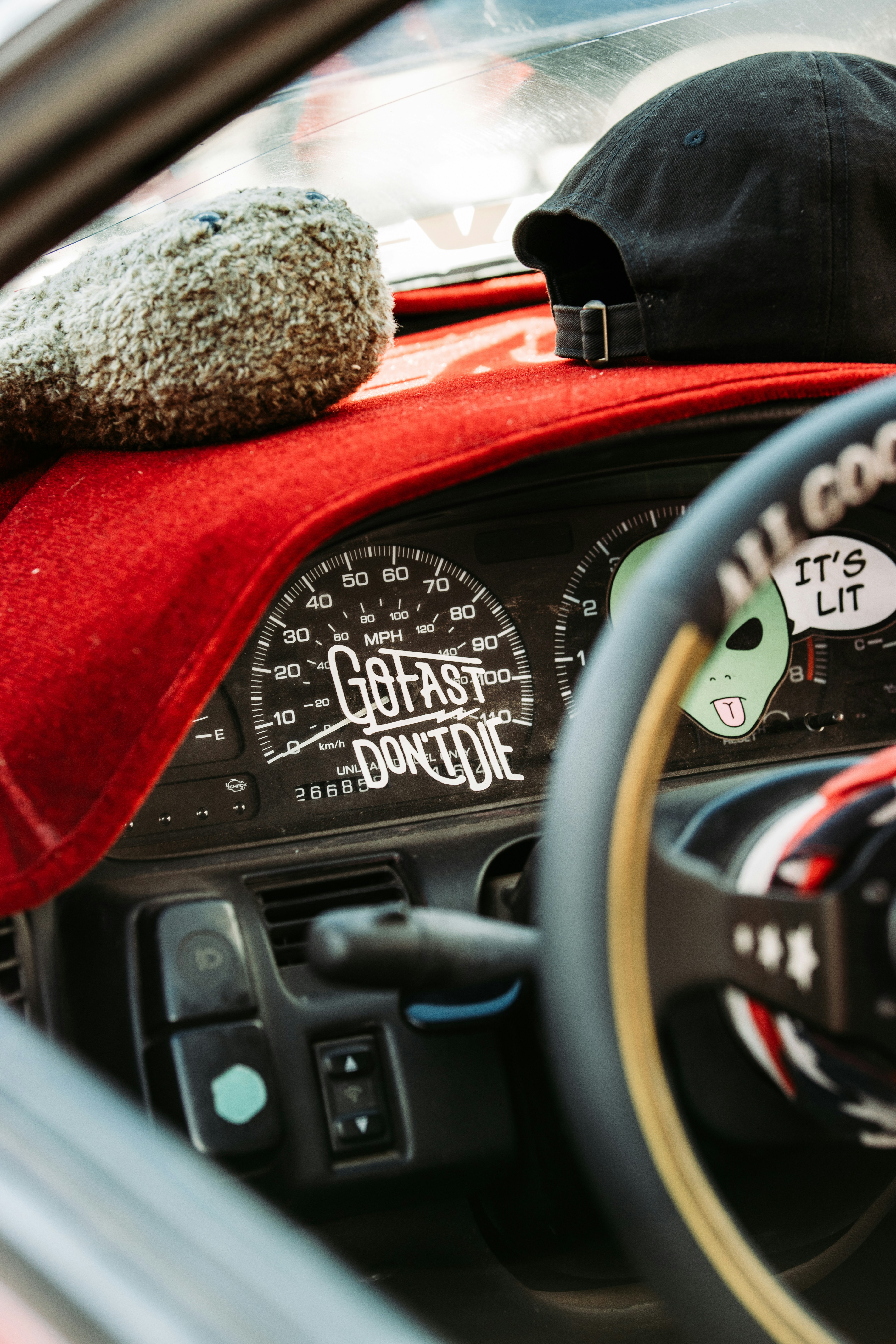 Stitched Gear and Warm Red Dash: A Car Interior Moment