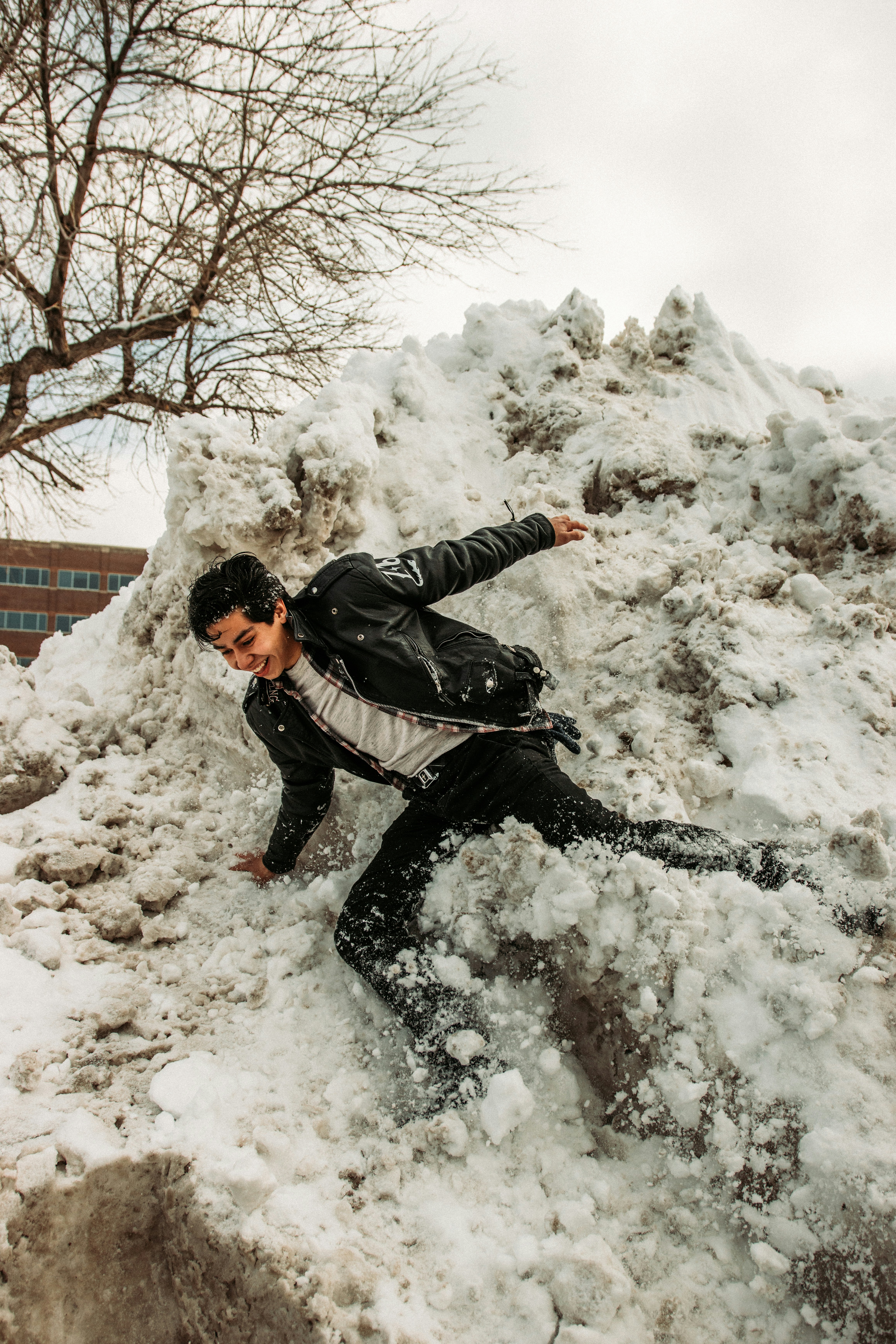 Snowbound Sprint: A Man Pivots off a Snowbank in a Flurry