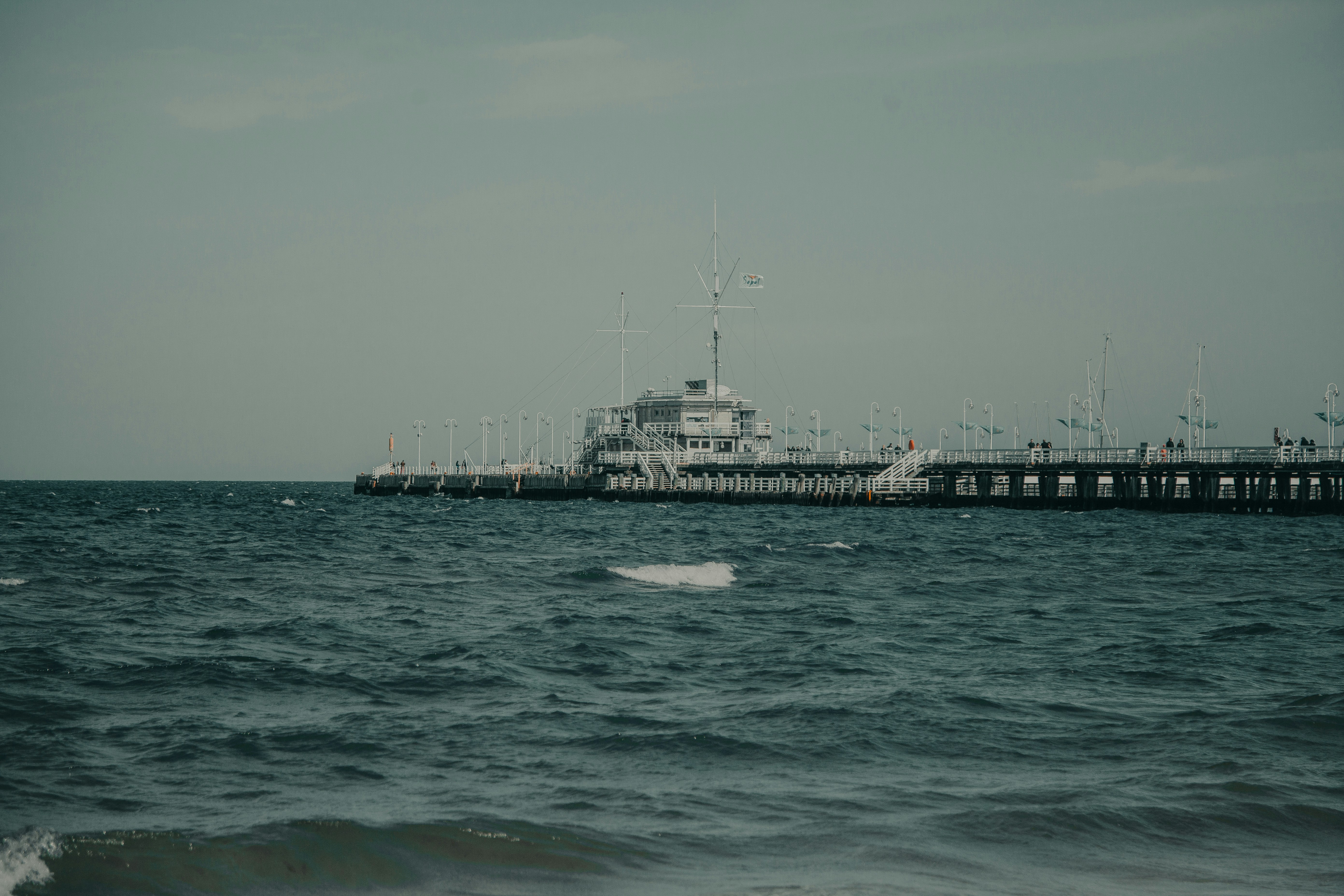 white ship on sea during daytime