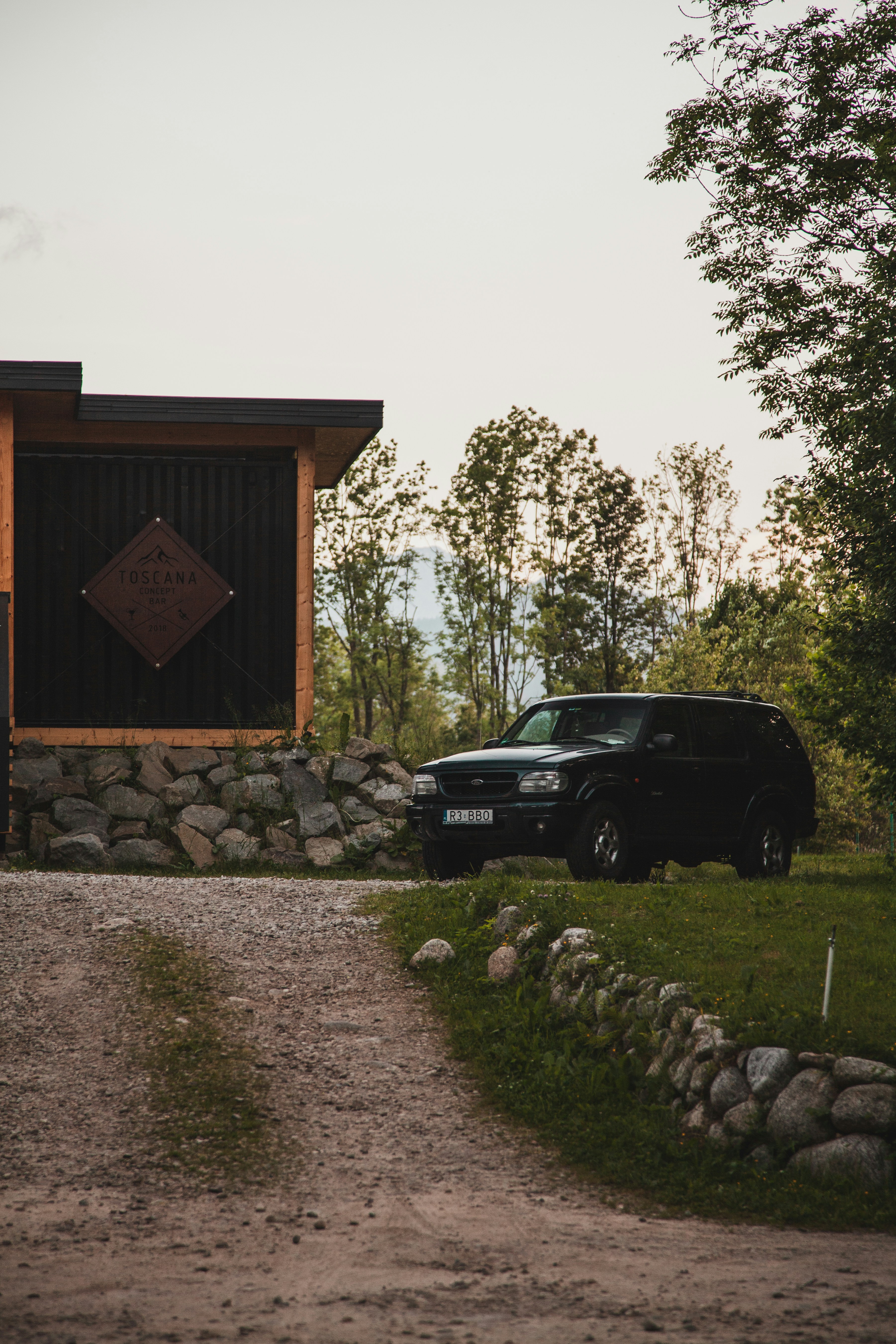 Distant Gatekeeper: A Quiet Drive Past the Tuscan Lodge
