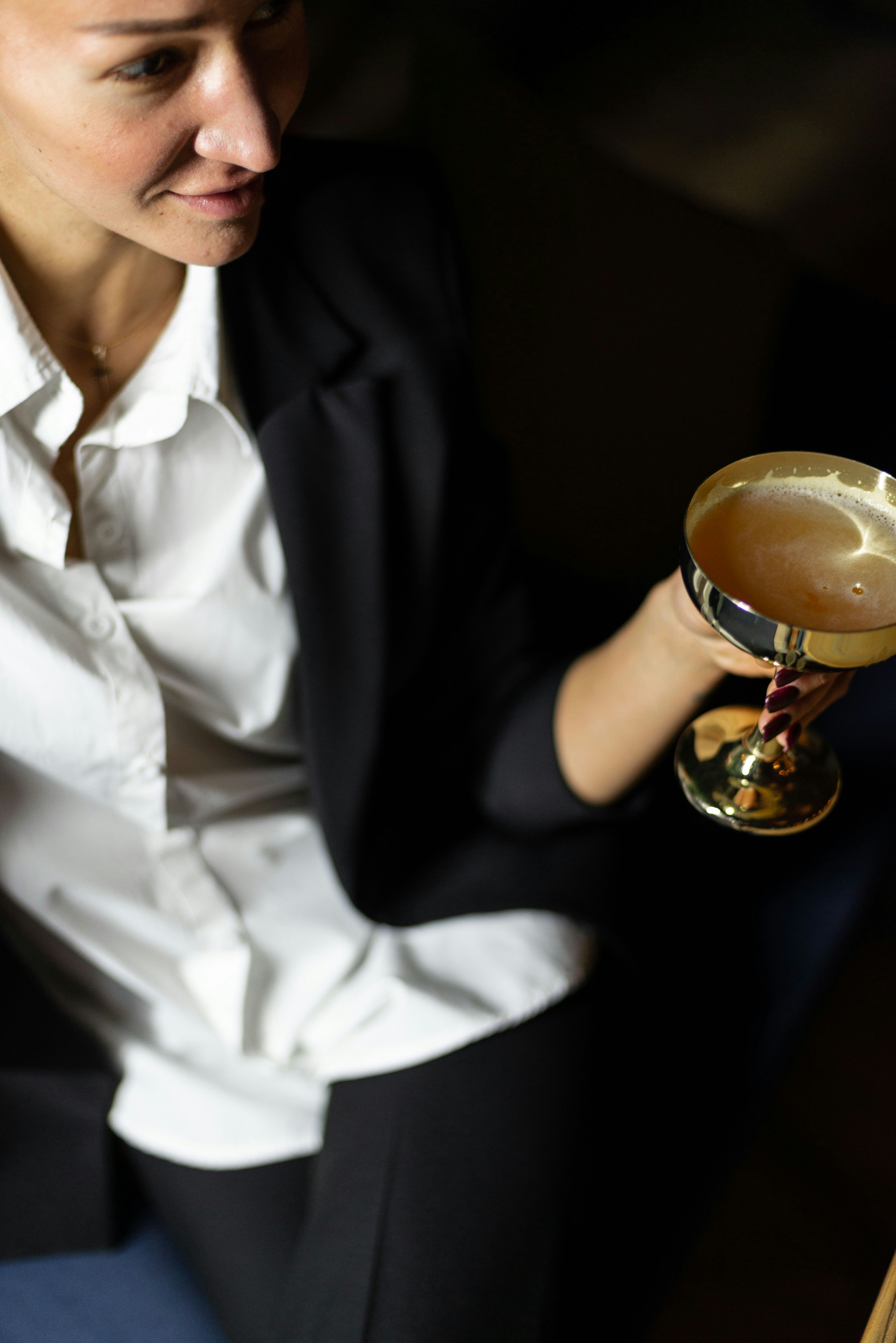 Amber Toast in Soft Light: A Professional Portrait with a Glass