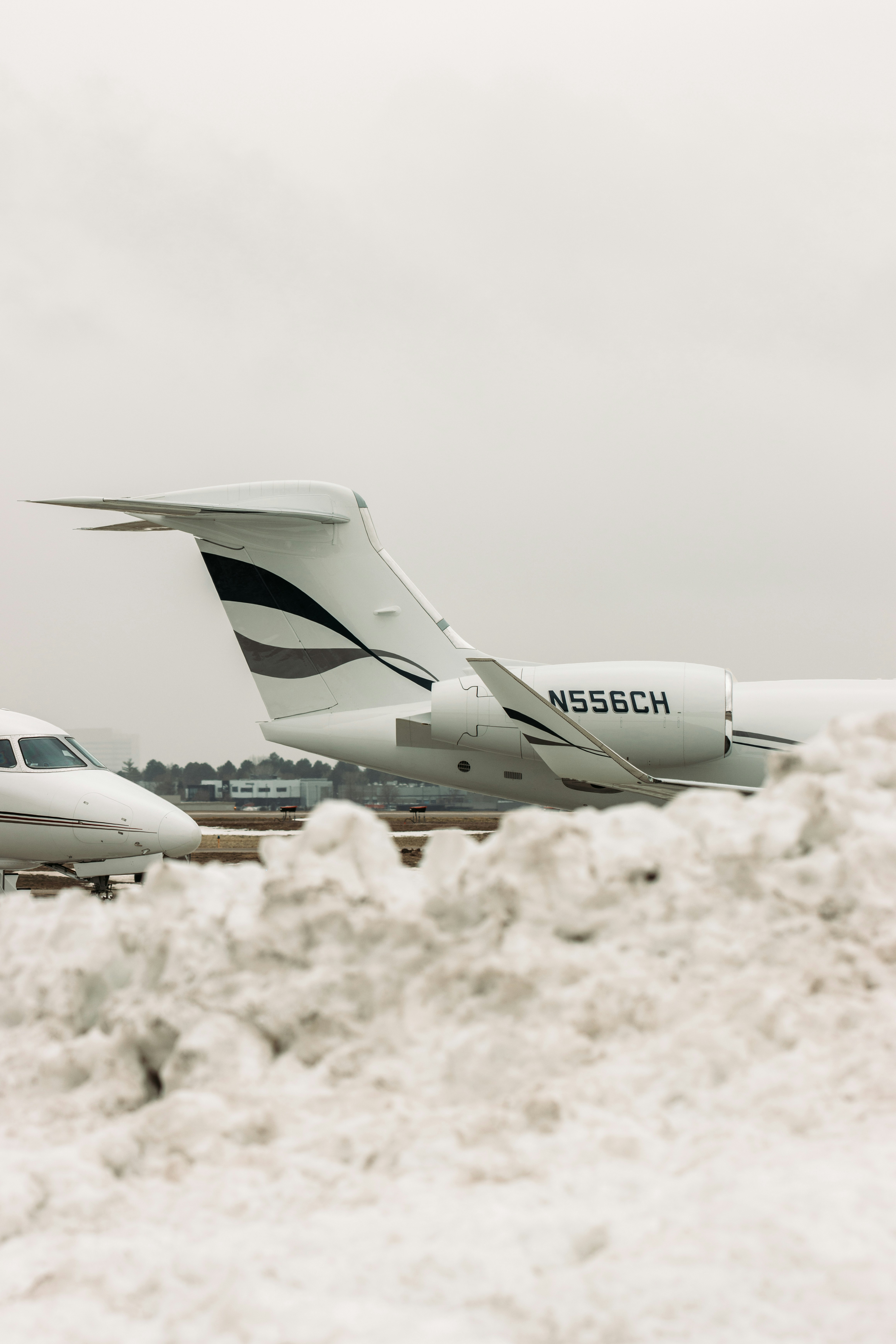 Tailwise Silence: A Private Jet at Rest Beyond Snowdrifts