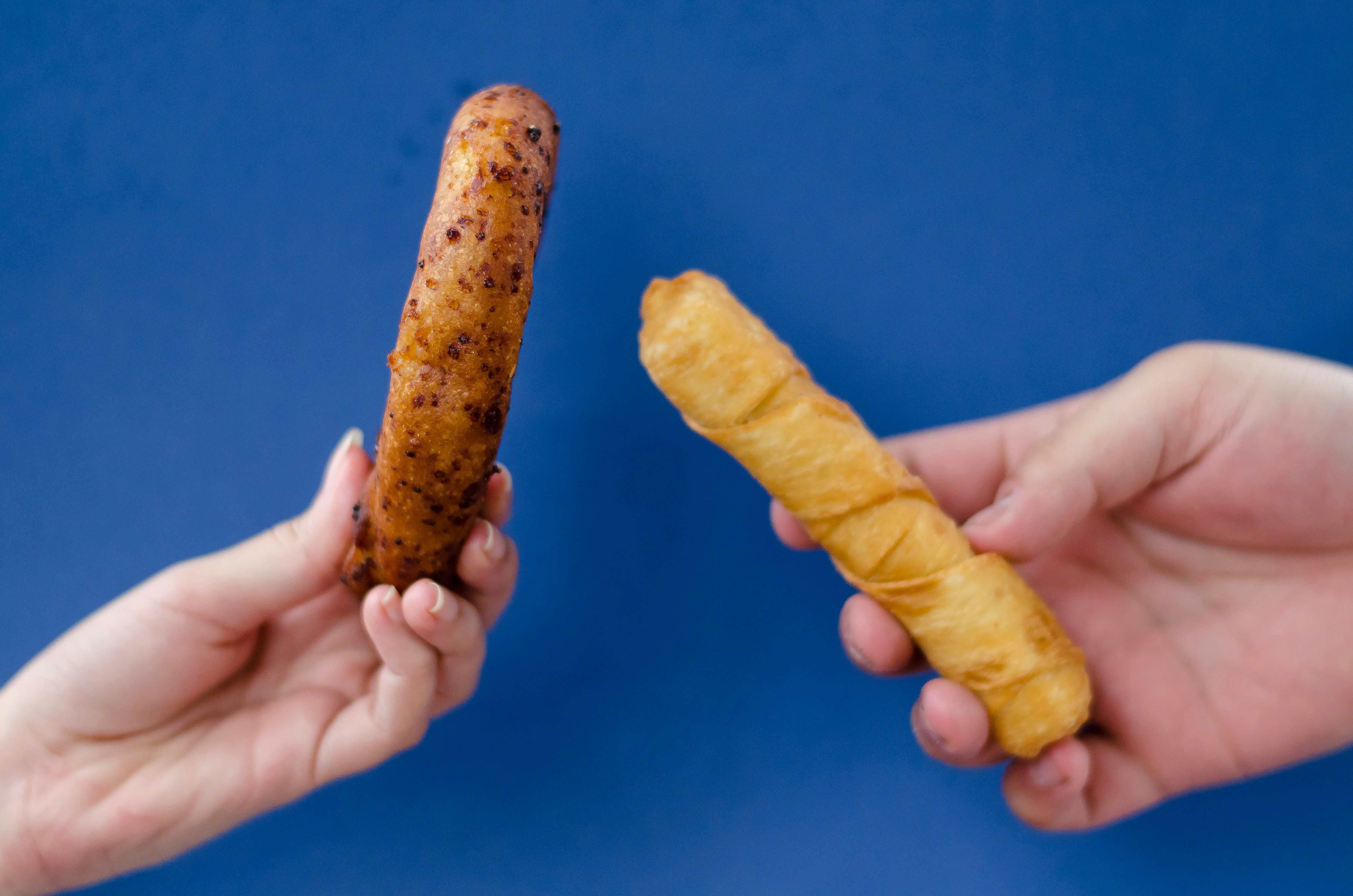 Two Snack Sticks Meet in a Bright Blue Moment