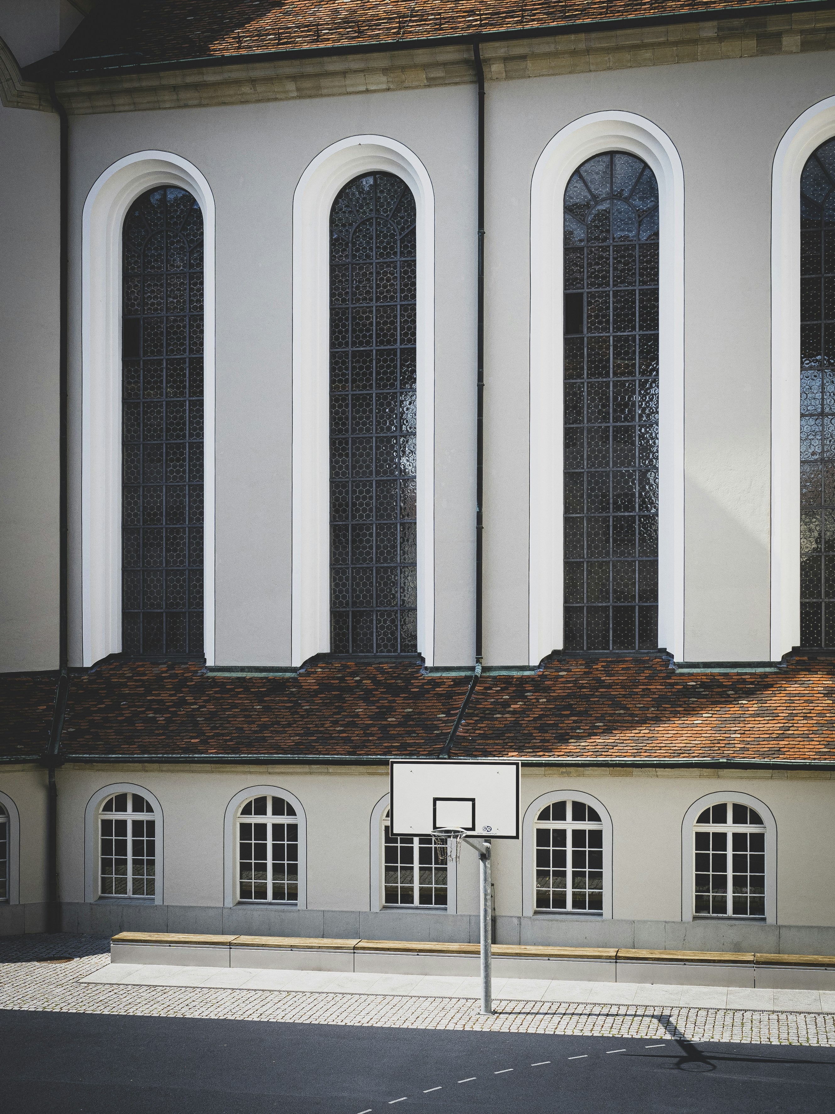 Arched Windows and a Lone Hoop: Geometry of a Schoolyard Facade