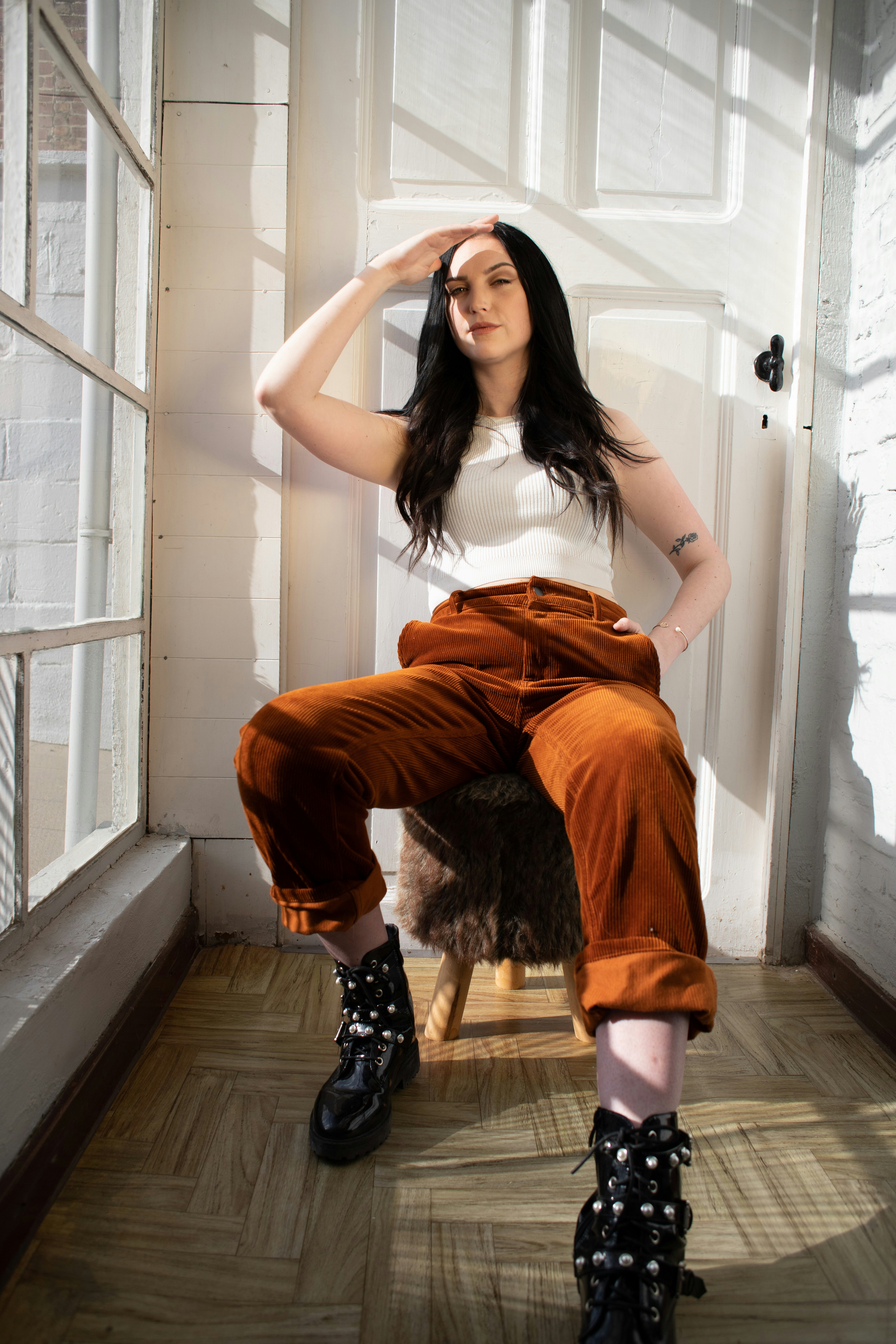 Sunlit Confidence: A Bold Portrait in Indoor Light
