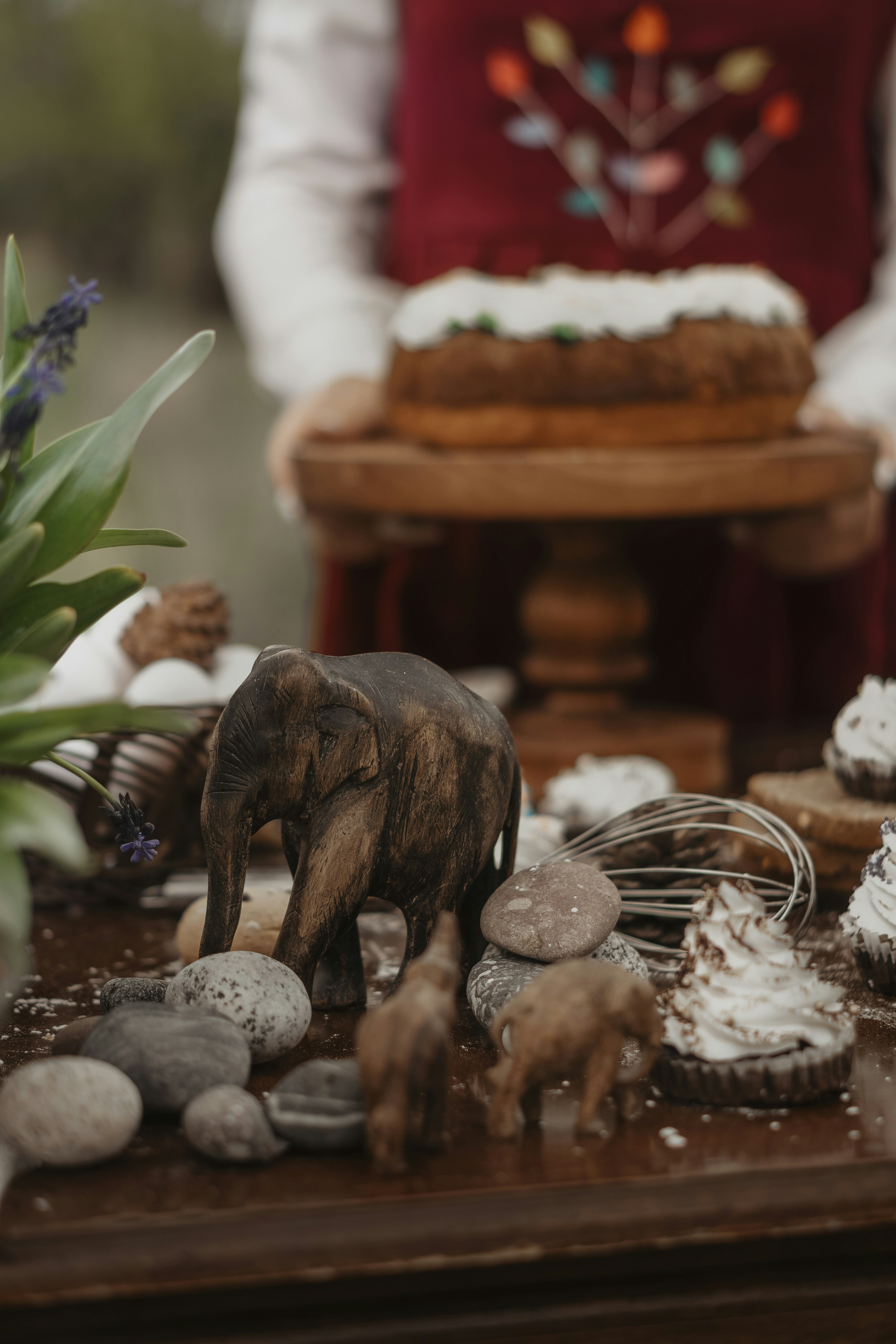 A Festive Tabletop Scene: Tiny Animals and a Cake