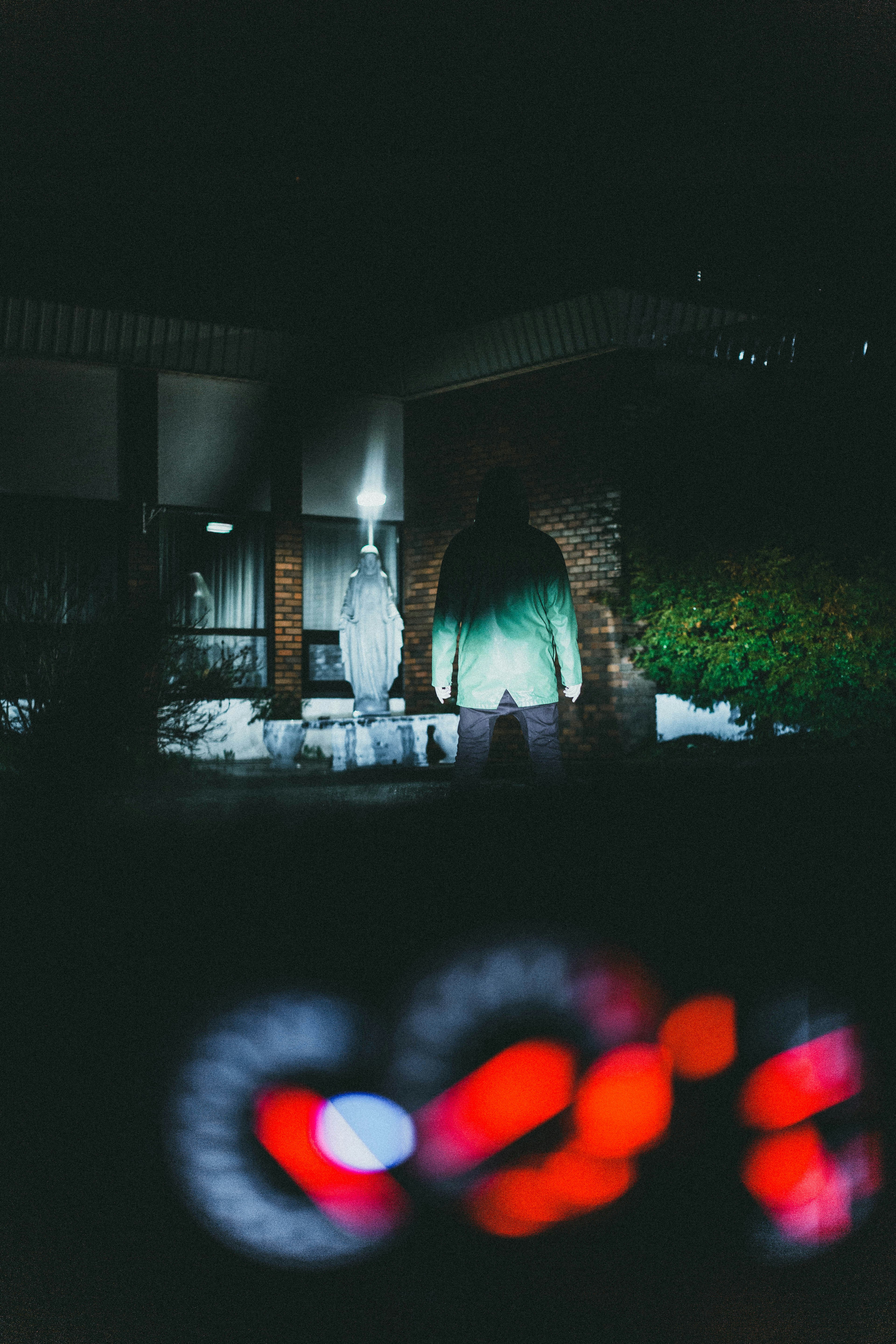 Moonlit Figure at the Entrance: A Quiet Night Standoff