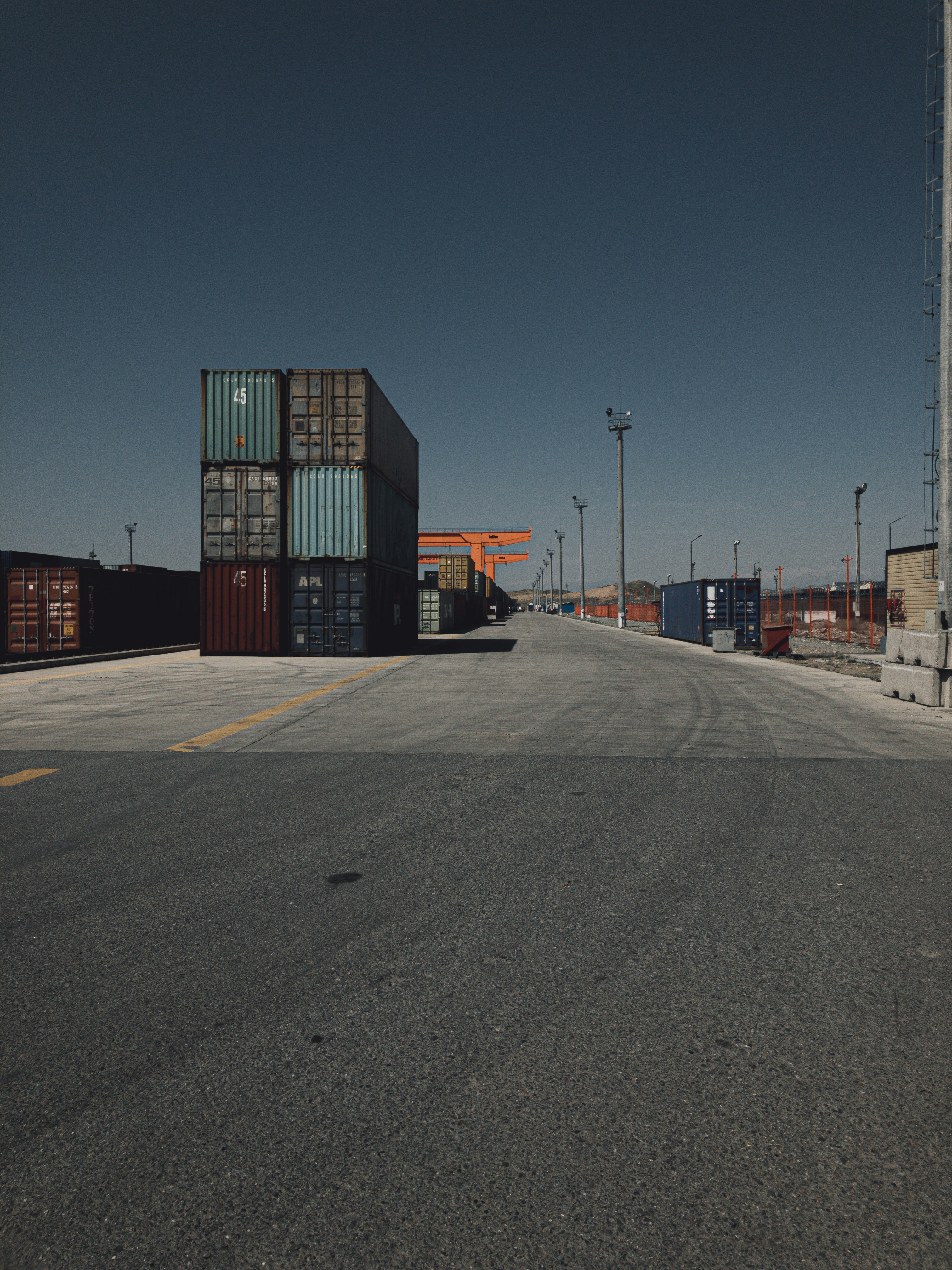 Red and blue intermodal containers on a sunny day photo – Free Building ...