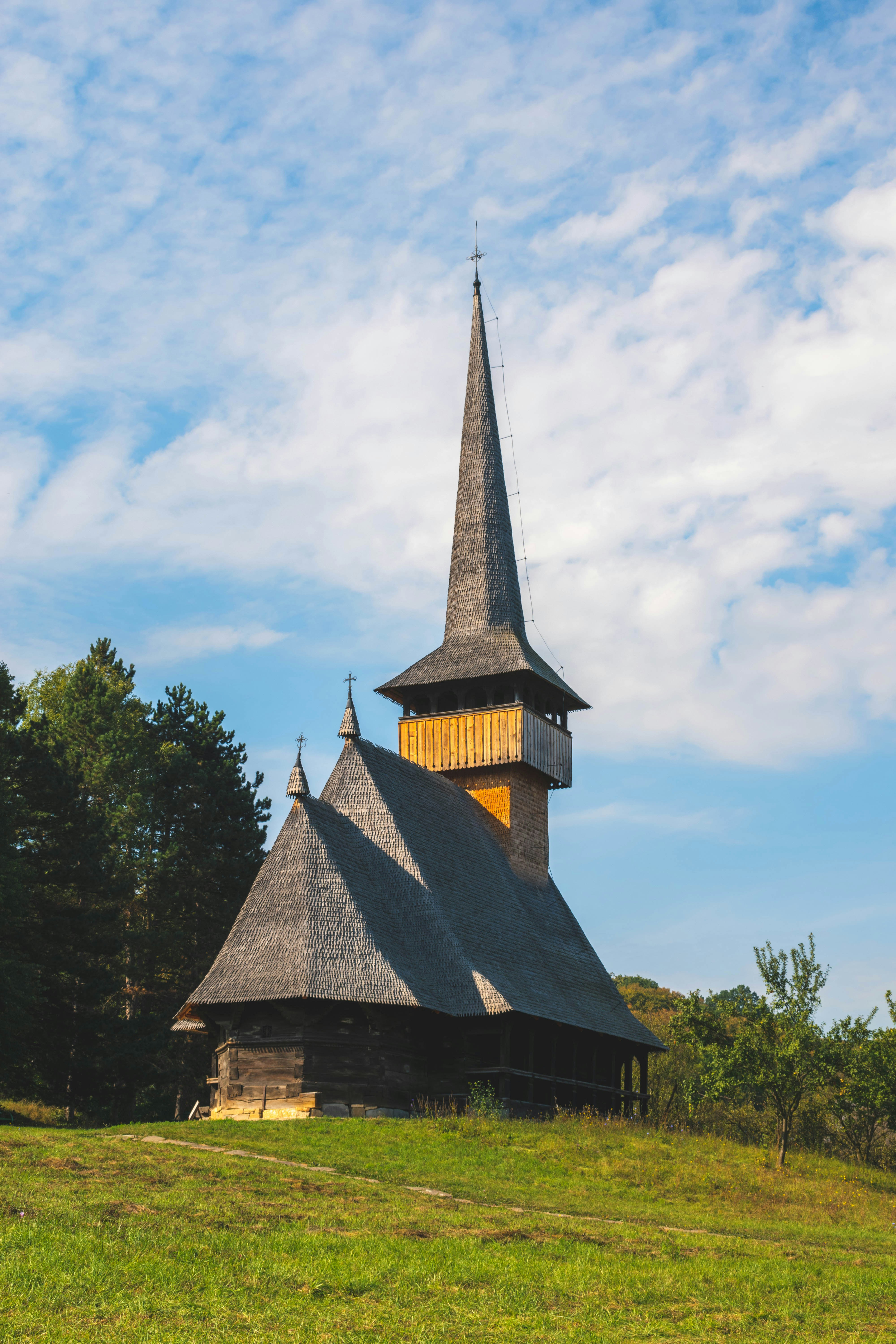 Timber-Spired Chapel Rising Over a Quiet Prairie