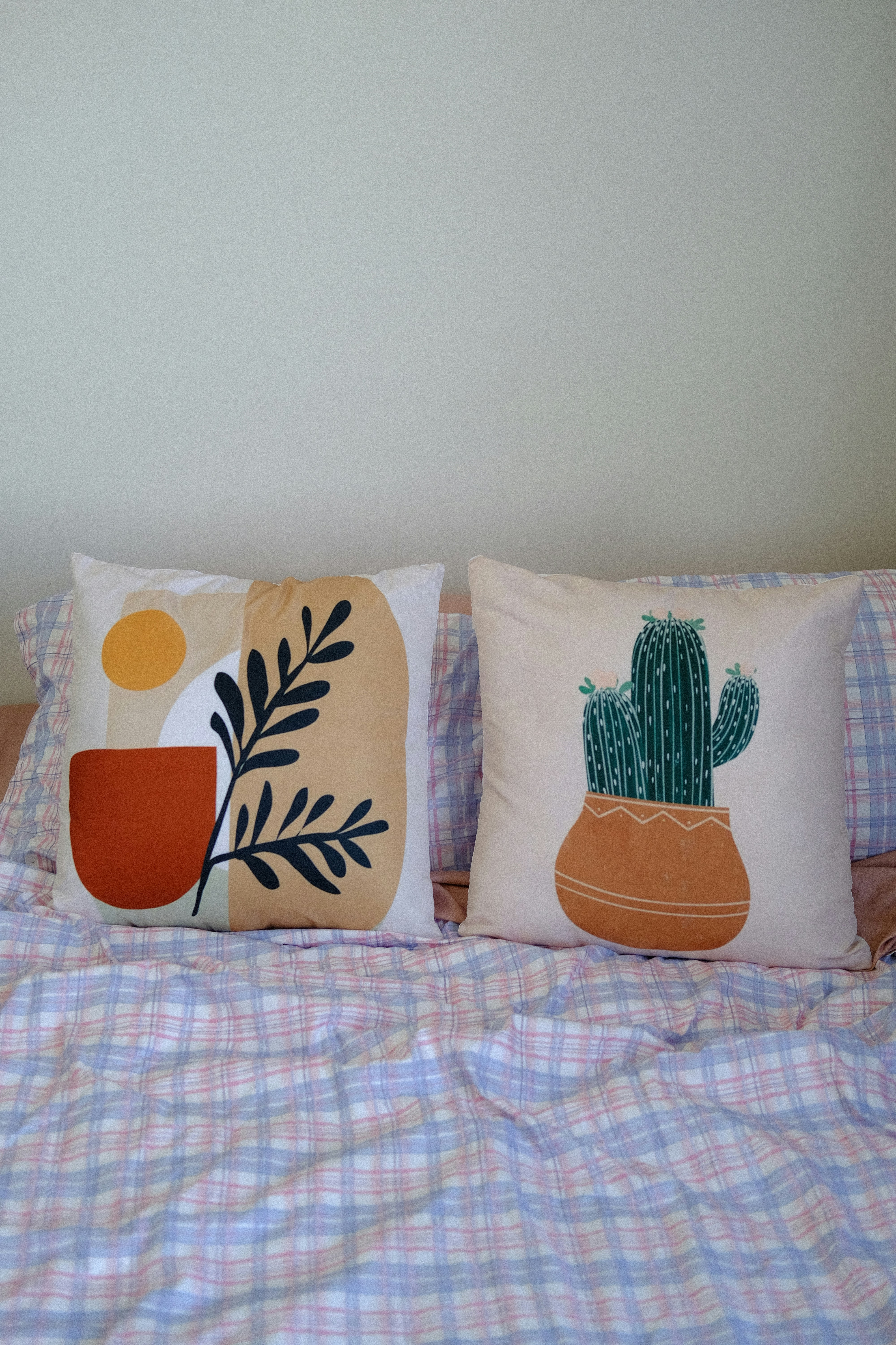 Desert Cactus and Leafy Silhouette on a Soft Plaid Bed