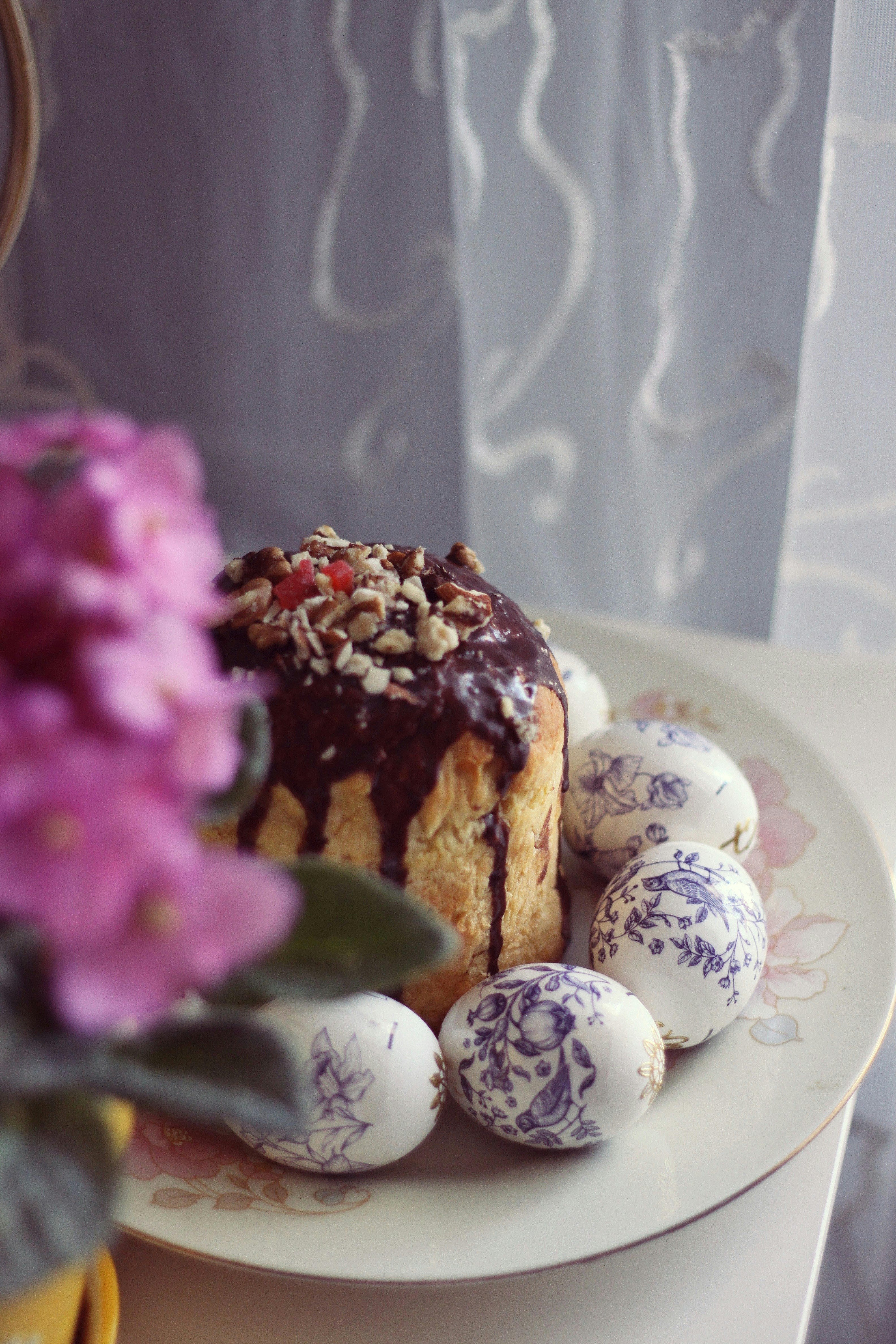 Delft-Patterned Eggs Cradle a Chocolate-Glazed Pastry